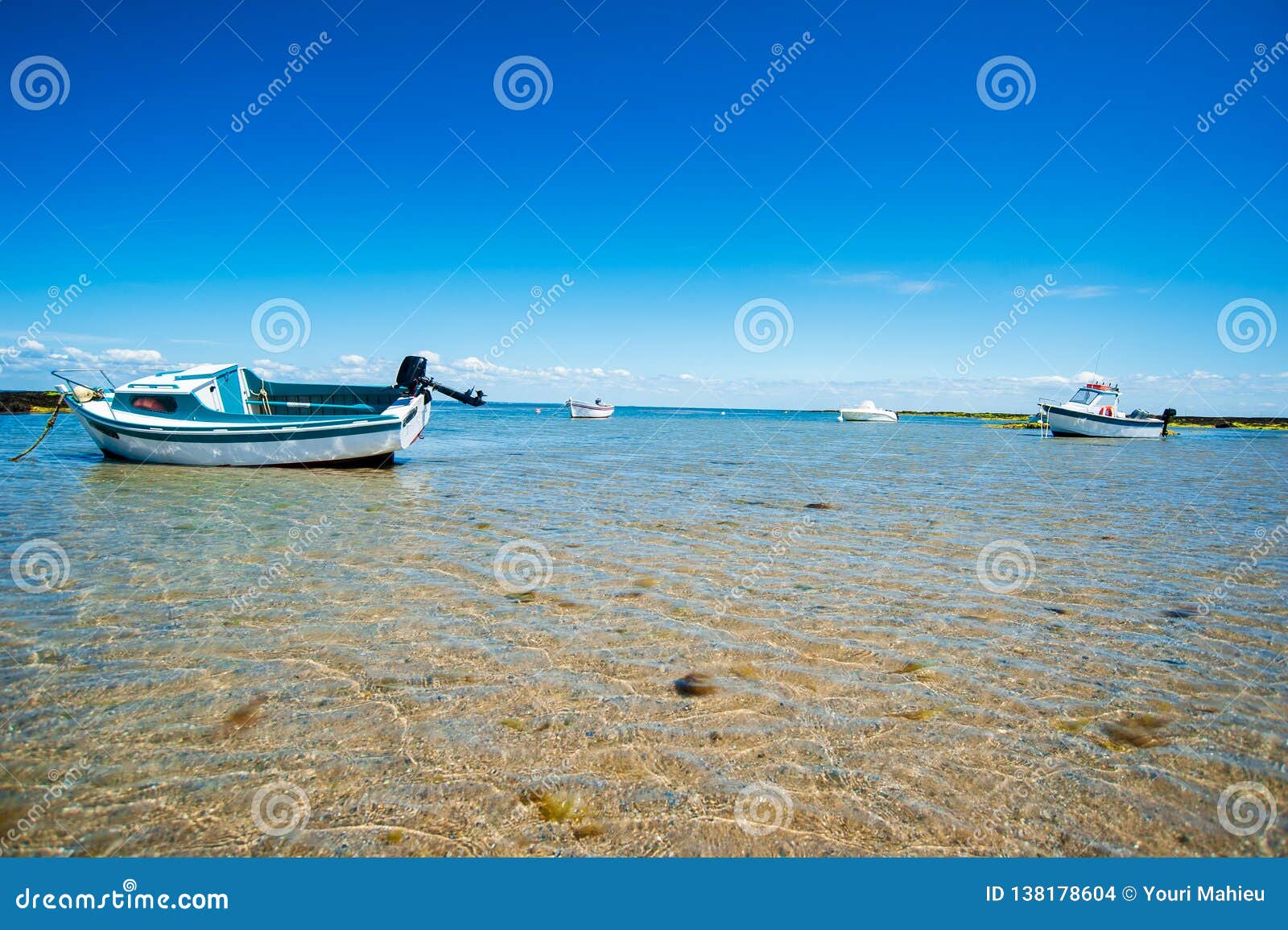 Stranded boats with water stock photo. Image of coast - 138178604