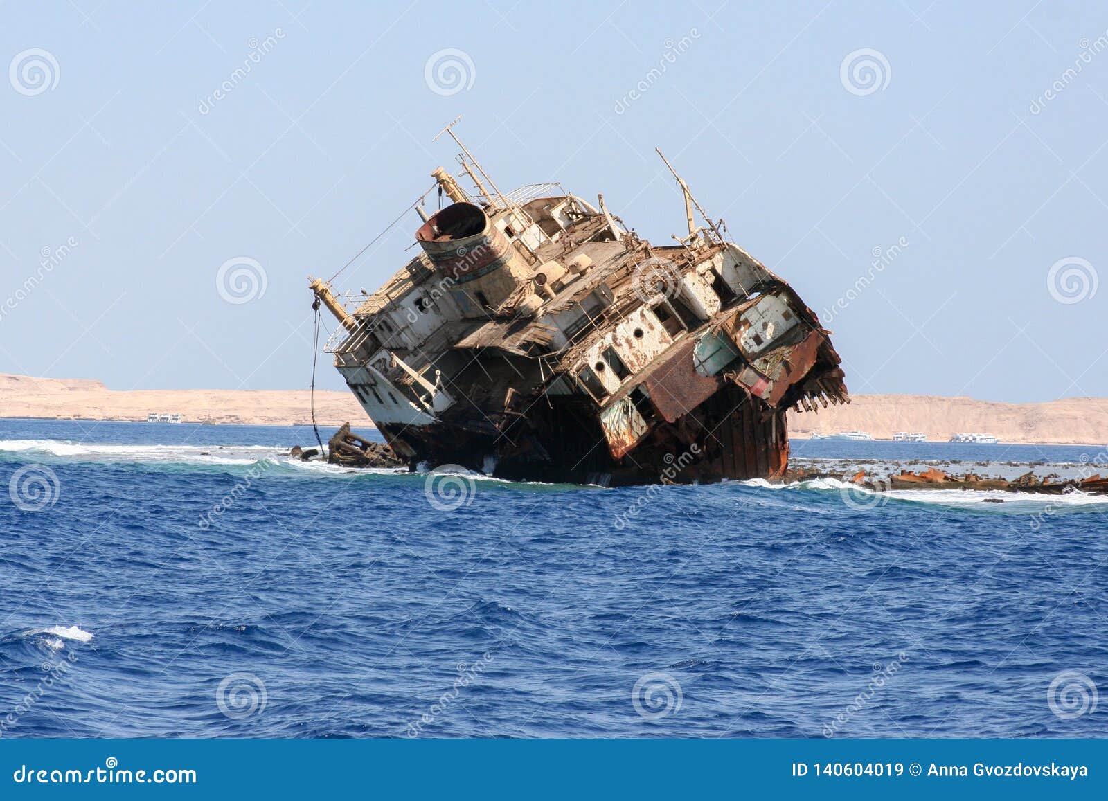 Old Rusty Ship Stranded, in the Sea, Against the Background of Sandy ...