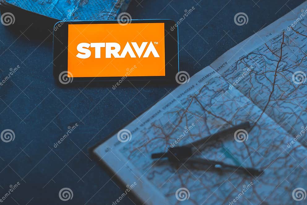 Strava Application on the Phone on a Dark Background with Map ...