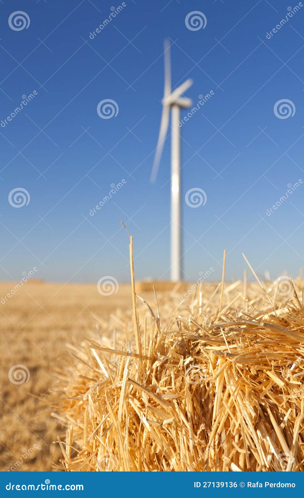 Straw Bale with a Wind Turbine Behind Stock Photo - Image of field ...