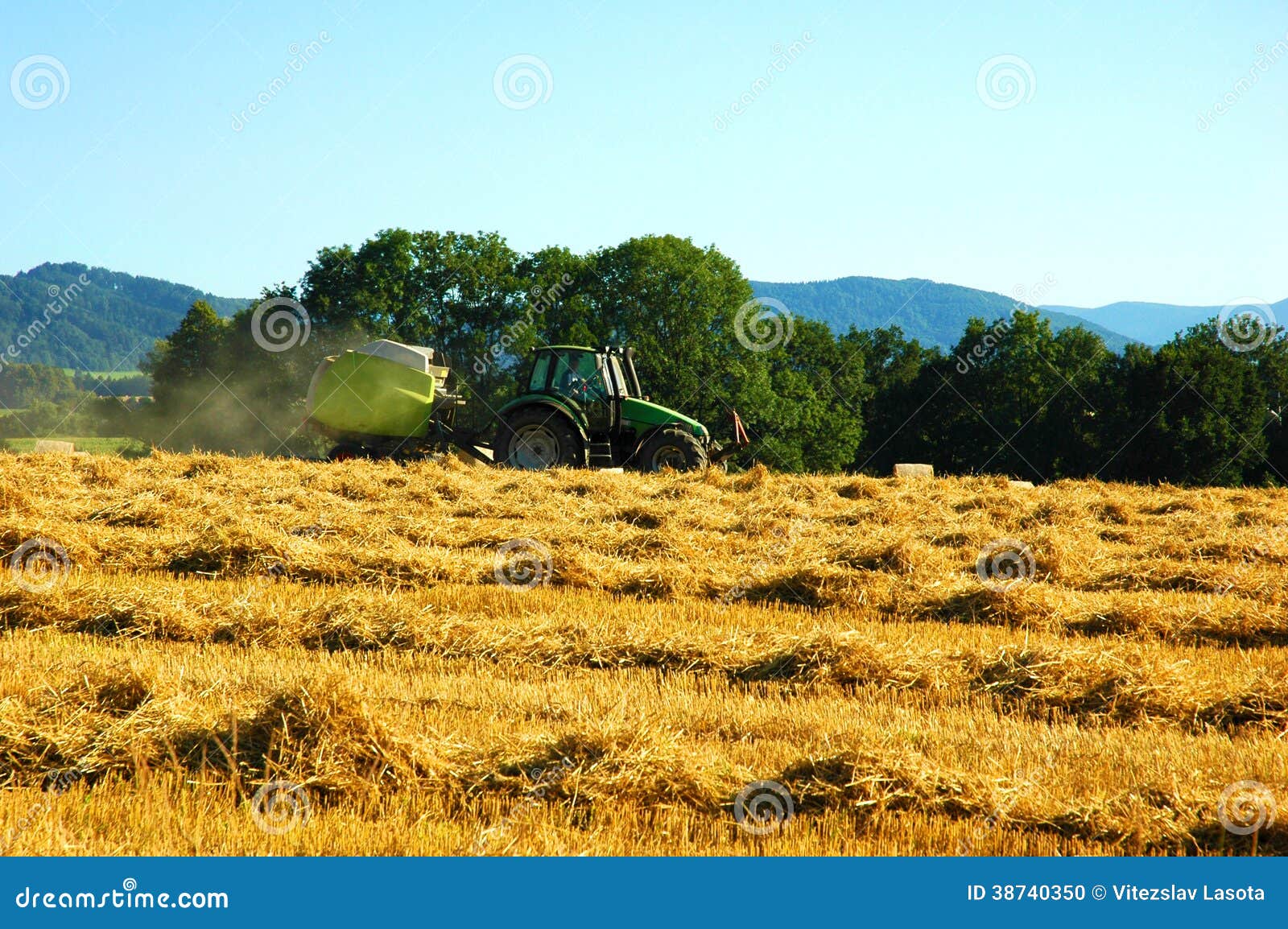 Straw Baling Tractor on Wheat Field. Stock Photo - Image of agriculture ...