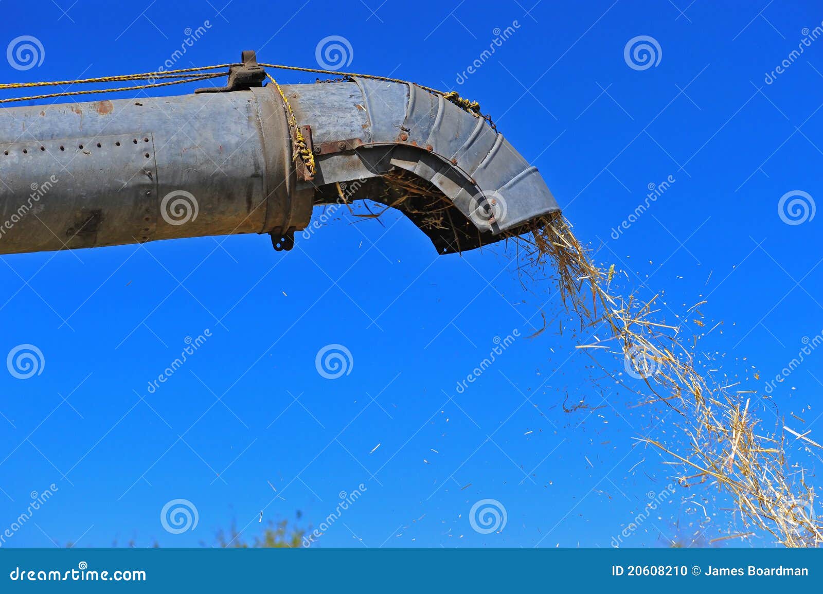 Straw Being Dispensed from a Retro Thrasher Stock Photo - Image of fork ...