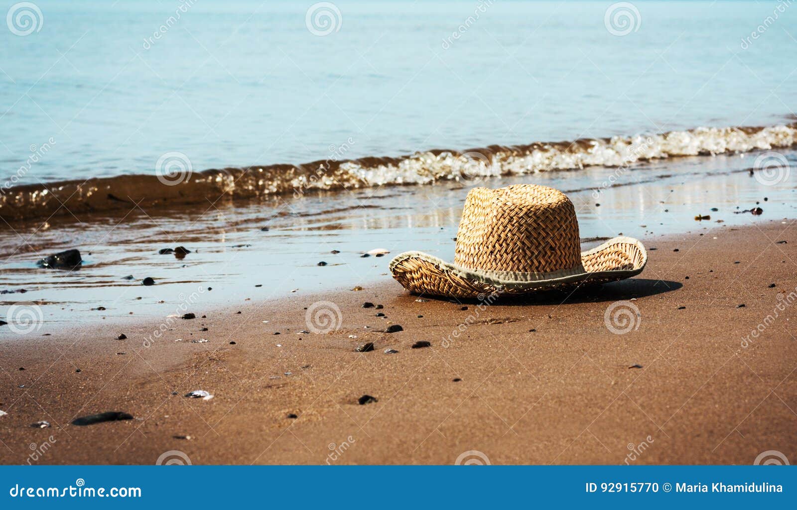 Straw hat on the beach stock photo. Image of flops, surf - 92915770
