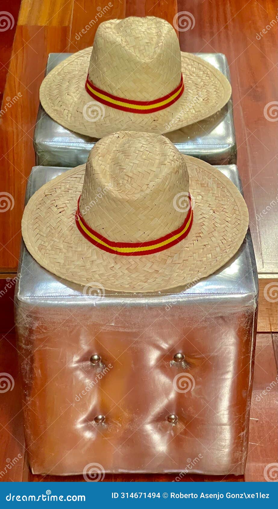 A Straw Hat Decorated with the Flag of Spain is Reflected in a Mirror ...