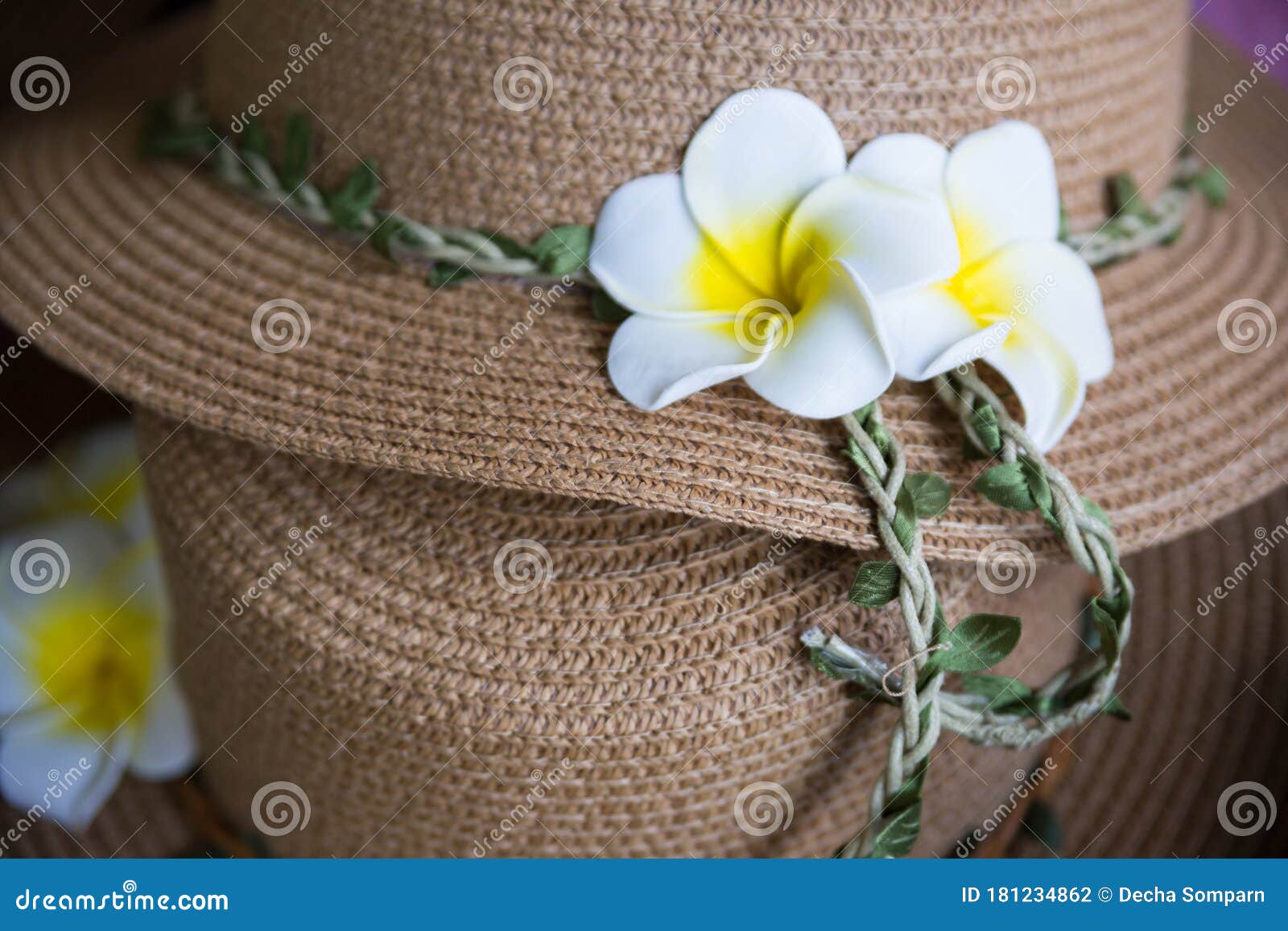 Straw Hat Decorated with Rope, Vines and White Flowers Stock Photo ...