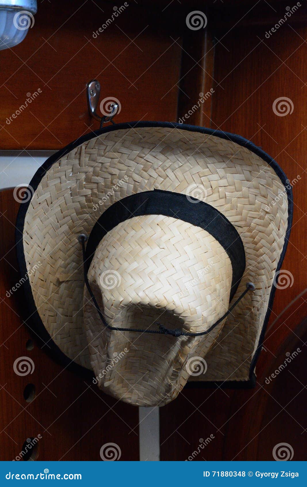 Straw Hat Hung On A Hook Stock Photo | CartoonDealer.com #71880348