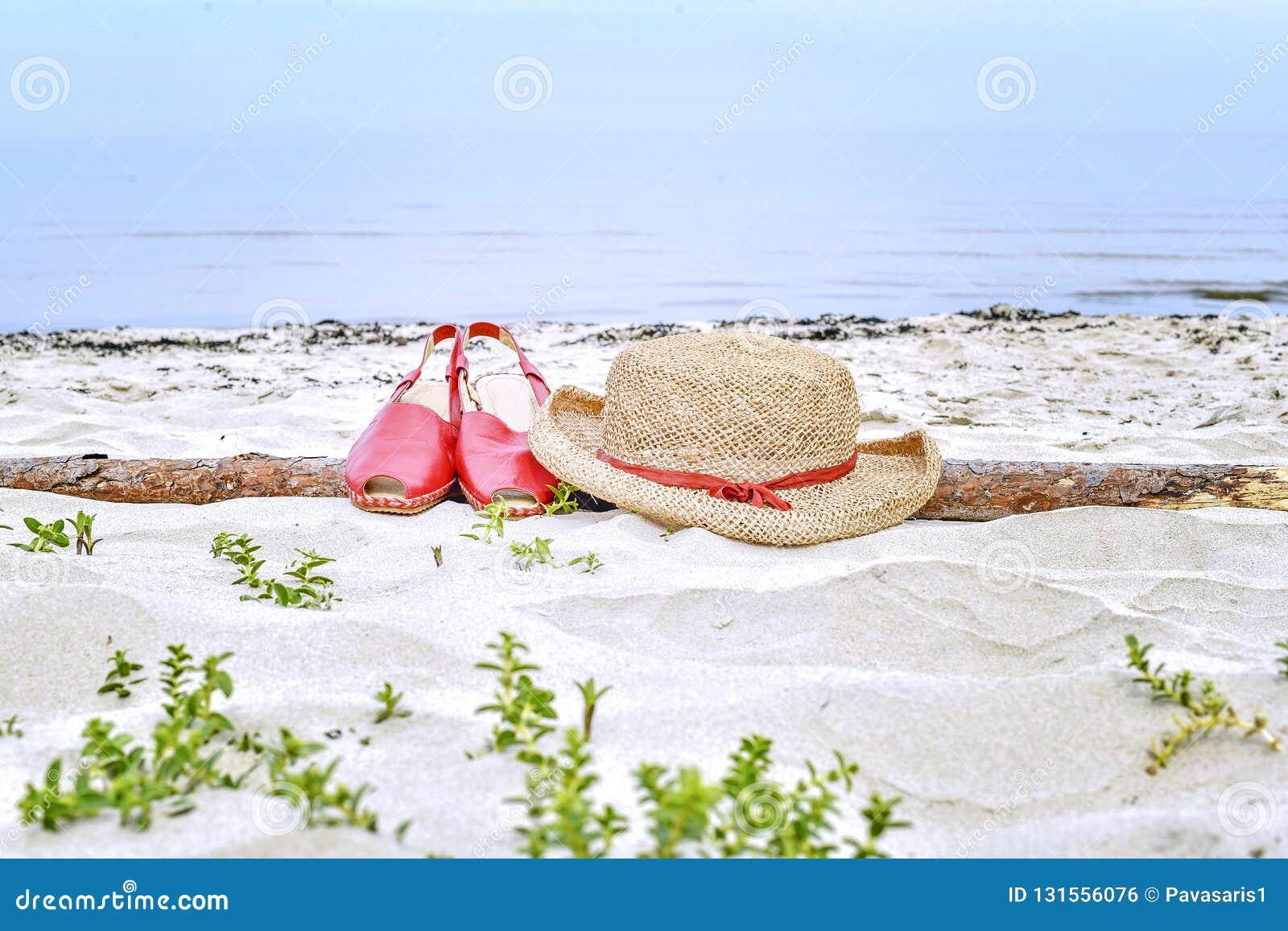Straw Hat and Sandals Lie on the Sand on the Beach Stock Photo - Image ...