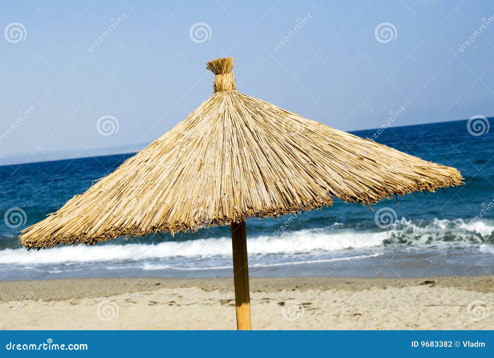 Straw parasol on the beach stock photo. Image of sandy - 9683382