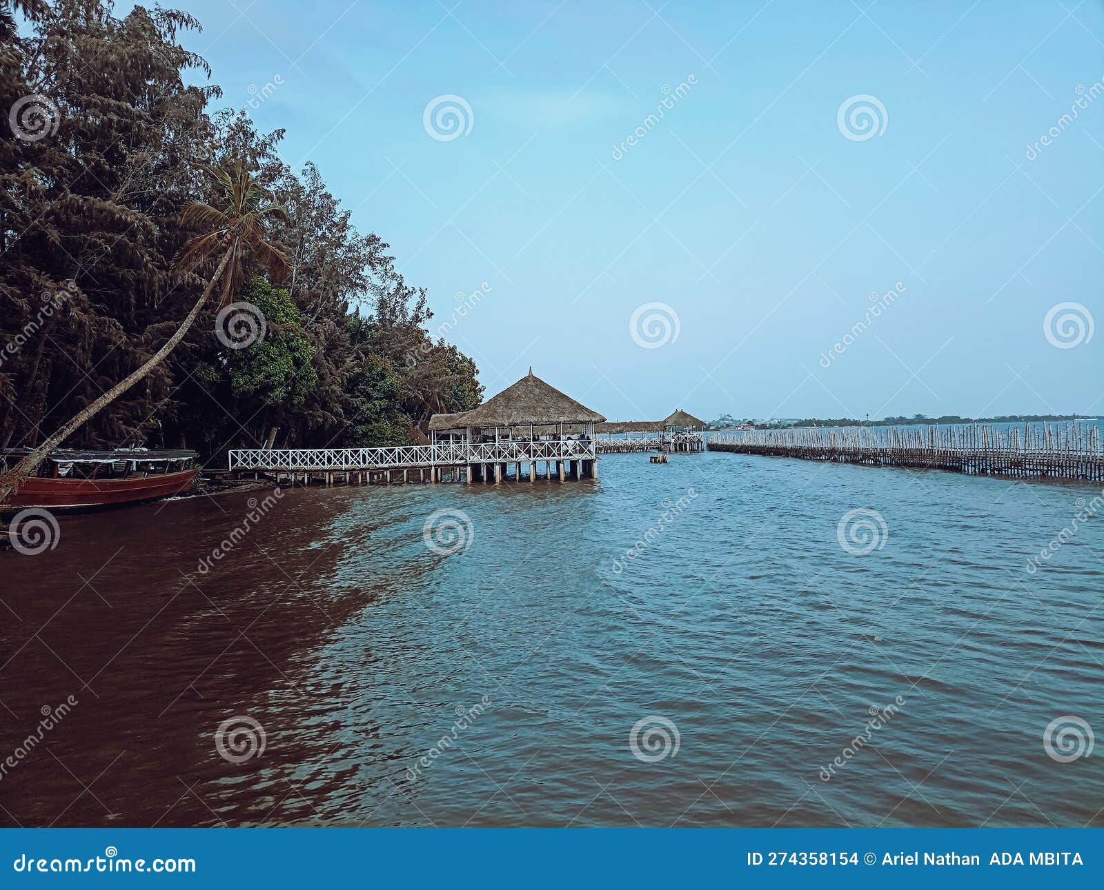Straw-roofed Hut on Stilts by the River Stock Photo - Image of shore ...
