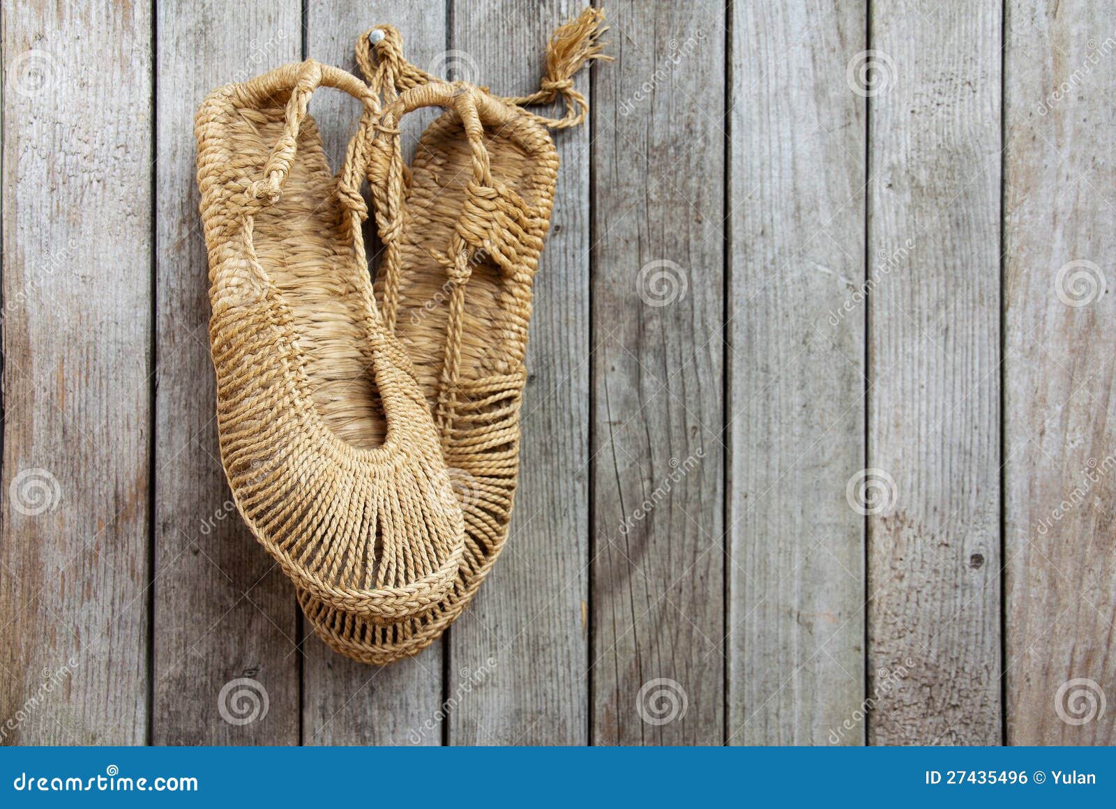 Straw shoes on wooden wall stock photo. Image of asian - 27435496