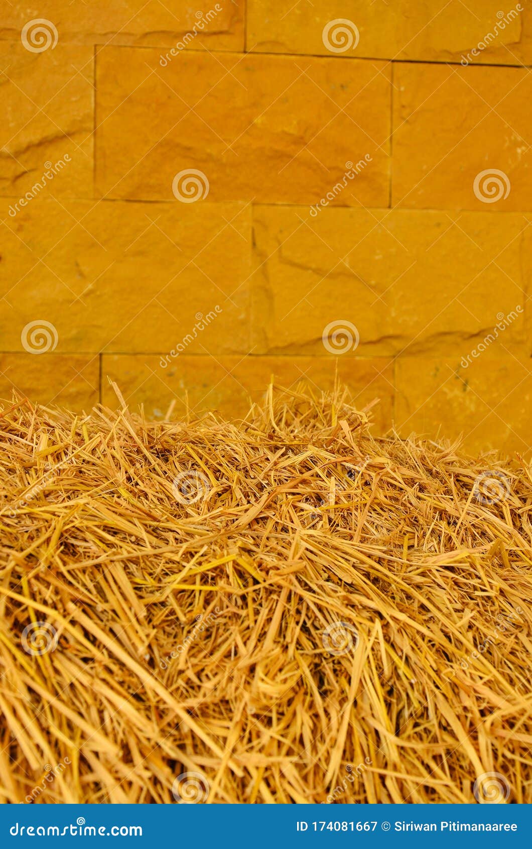 Straw Stack and Yellow Brick Wall Stock Image - Image of stack, wall ...