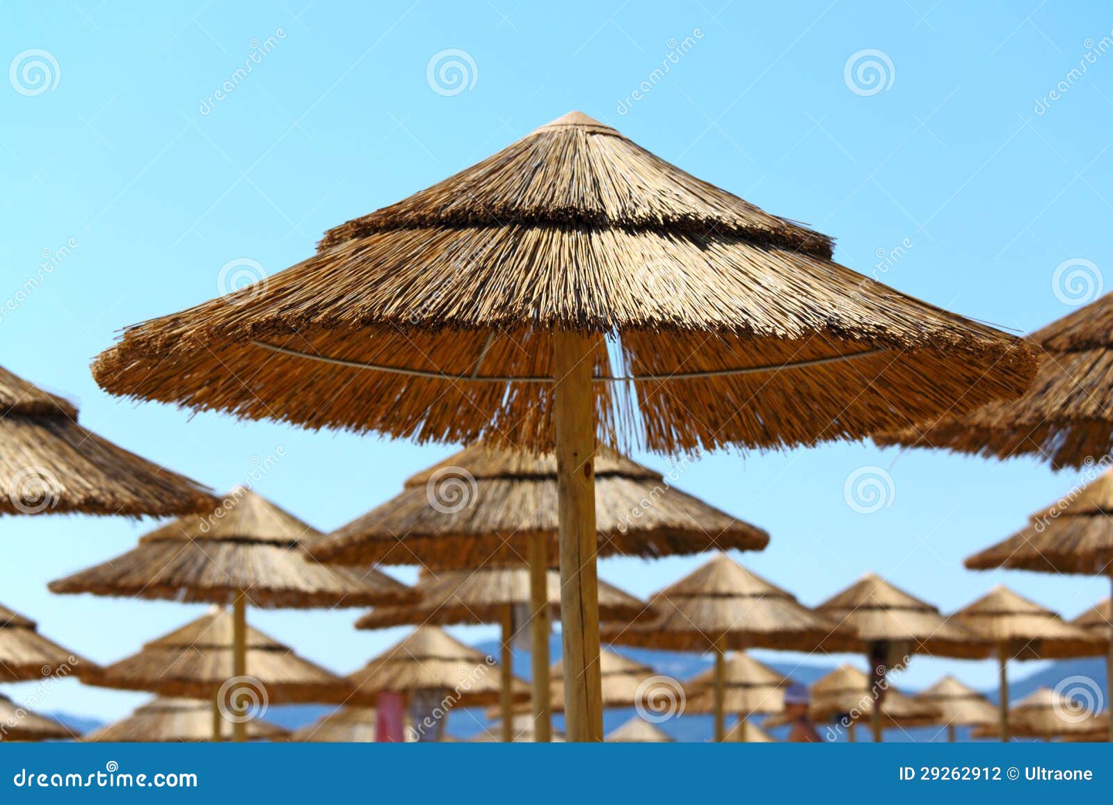 Straw Umbrellas on the Beach Stock Photo - Image of parasol, nature ...