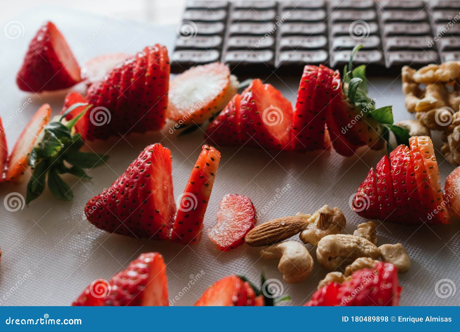 Strawberries Cut into Slices with Chocolate and Nuts Stock Photo ...