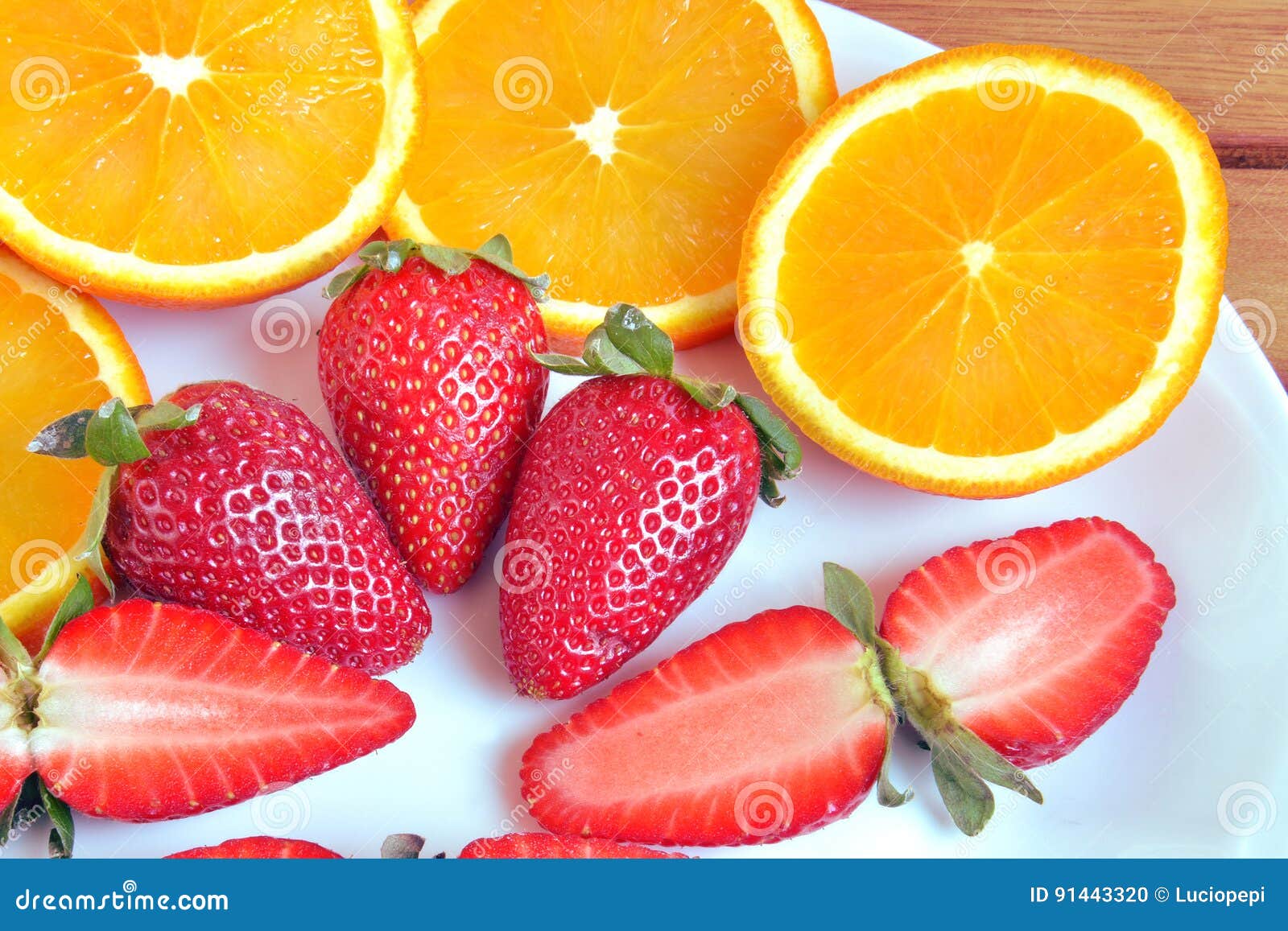Strawberries and oranges stock photo. Image of life, season - 91443320