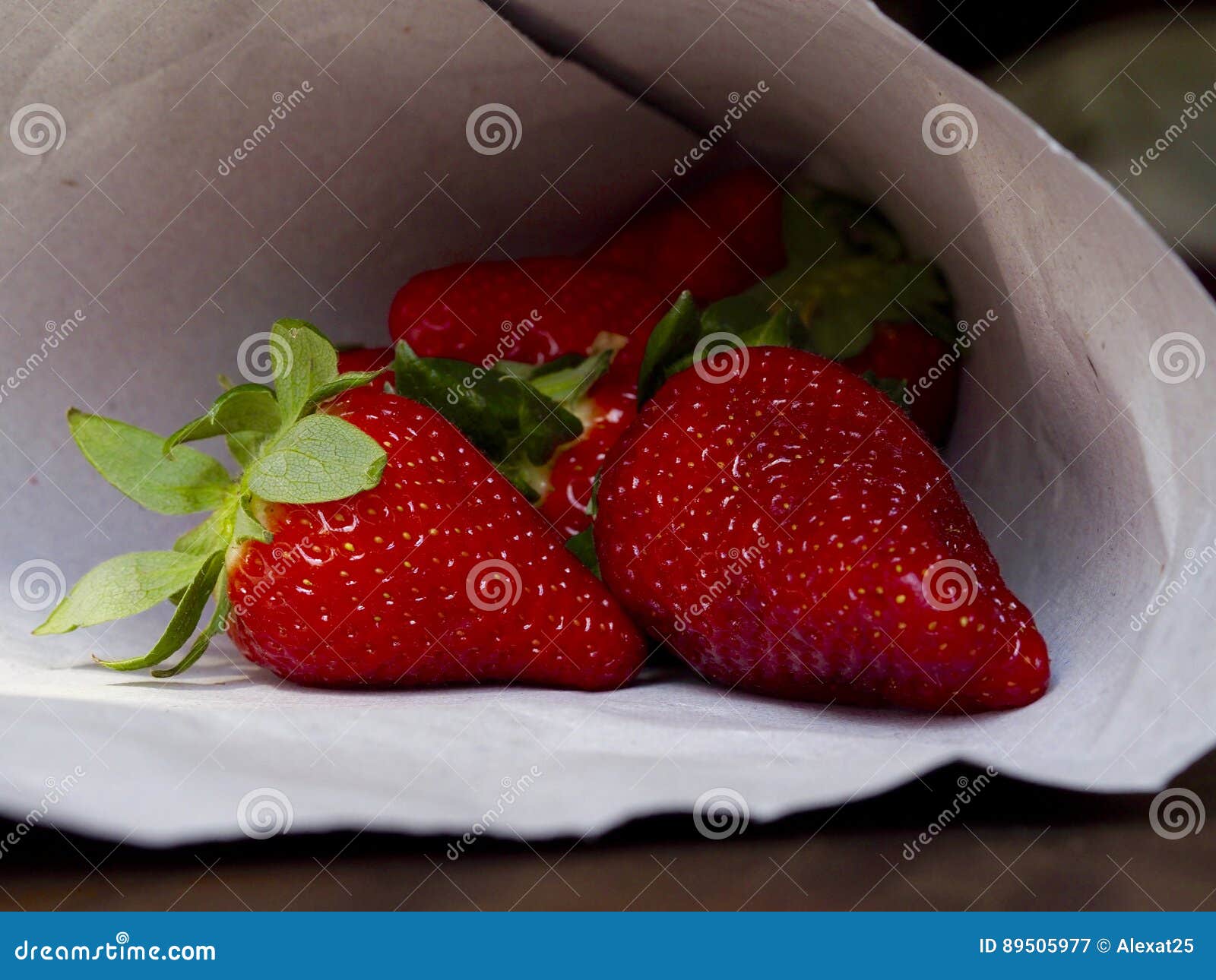 Strawberries on paper stock image. Image of sweet, nature - 89505977