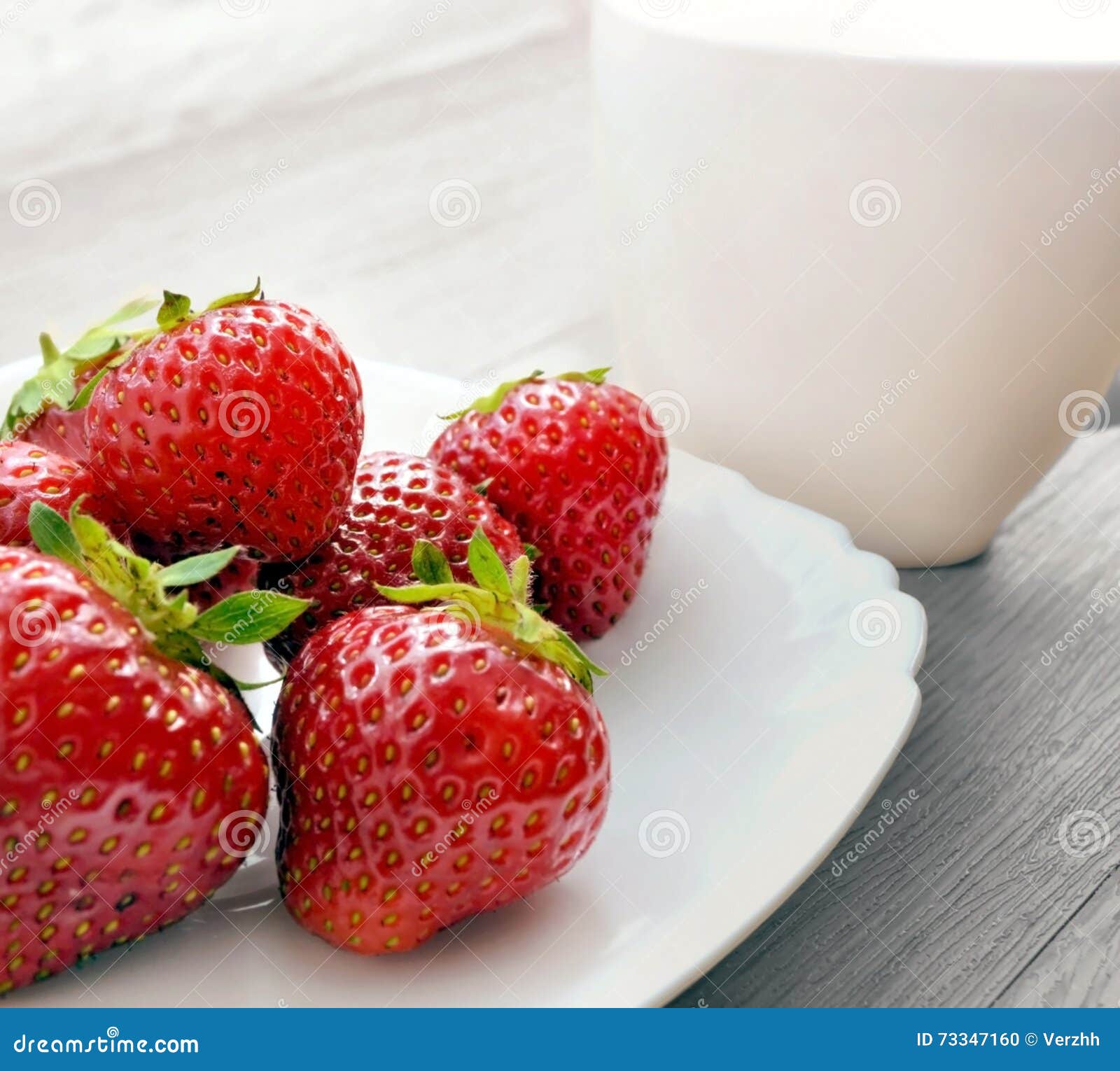 Strawberries on plate stock photo. Image of berry, white - 73347160
