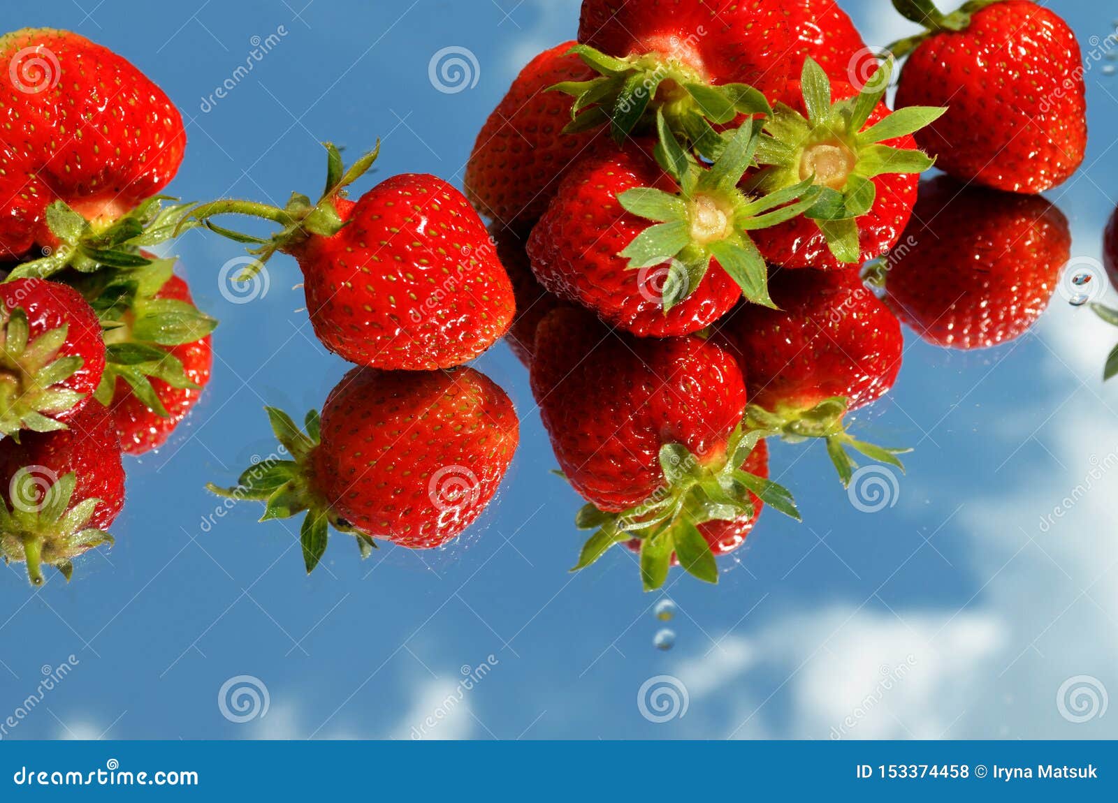 Strawberries are Reflected in the Mirror Against the Background of ...