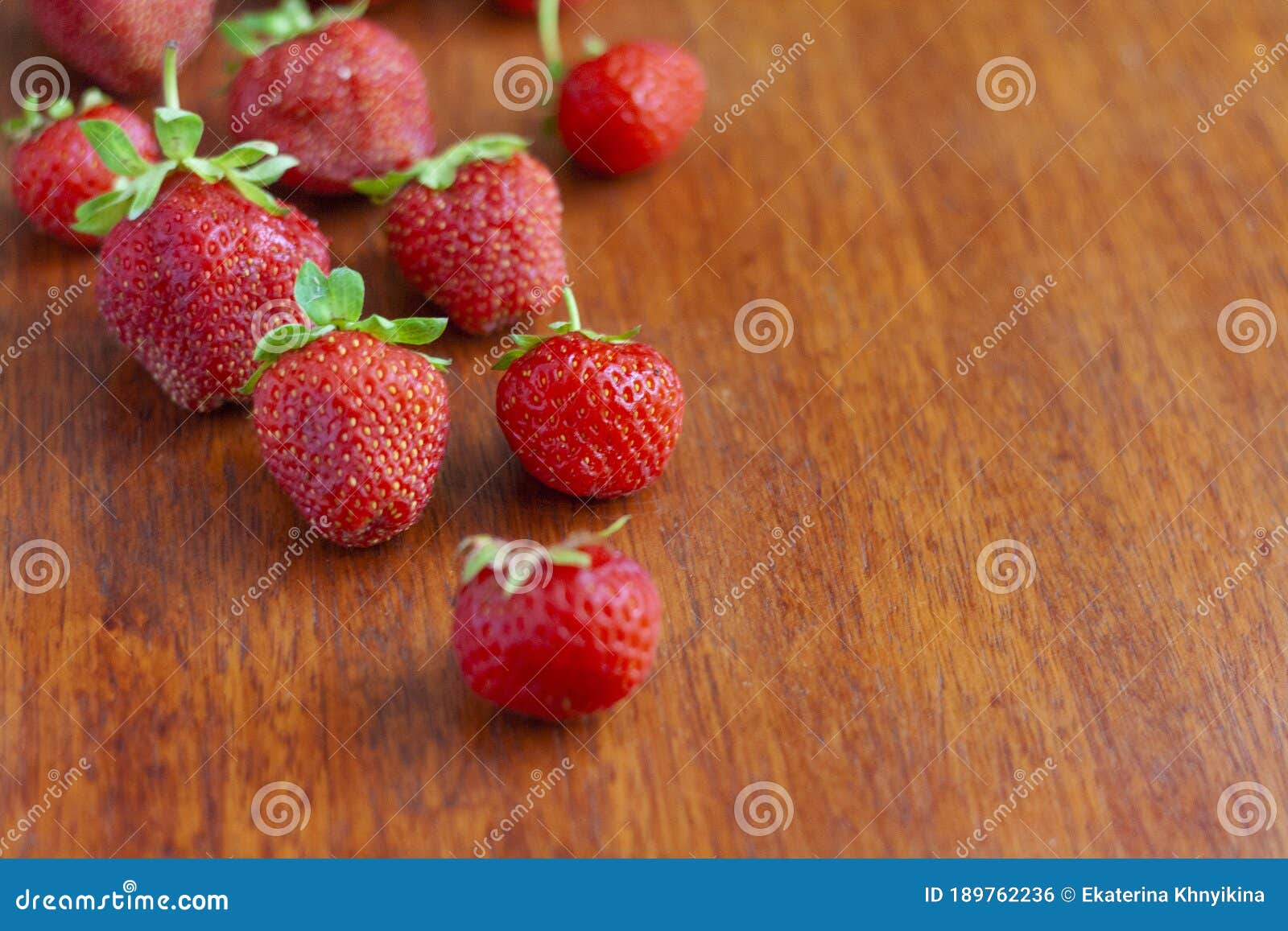 Strawberries are Scattered on the Wooden Table Stock Photo - Image of ...