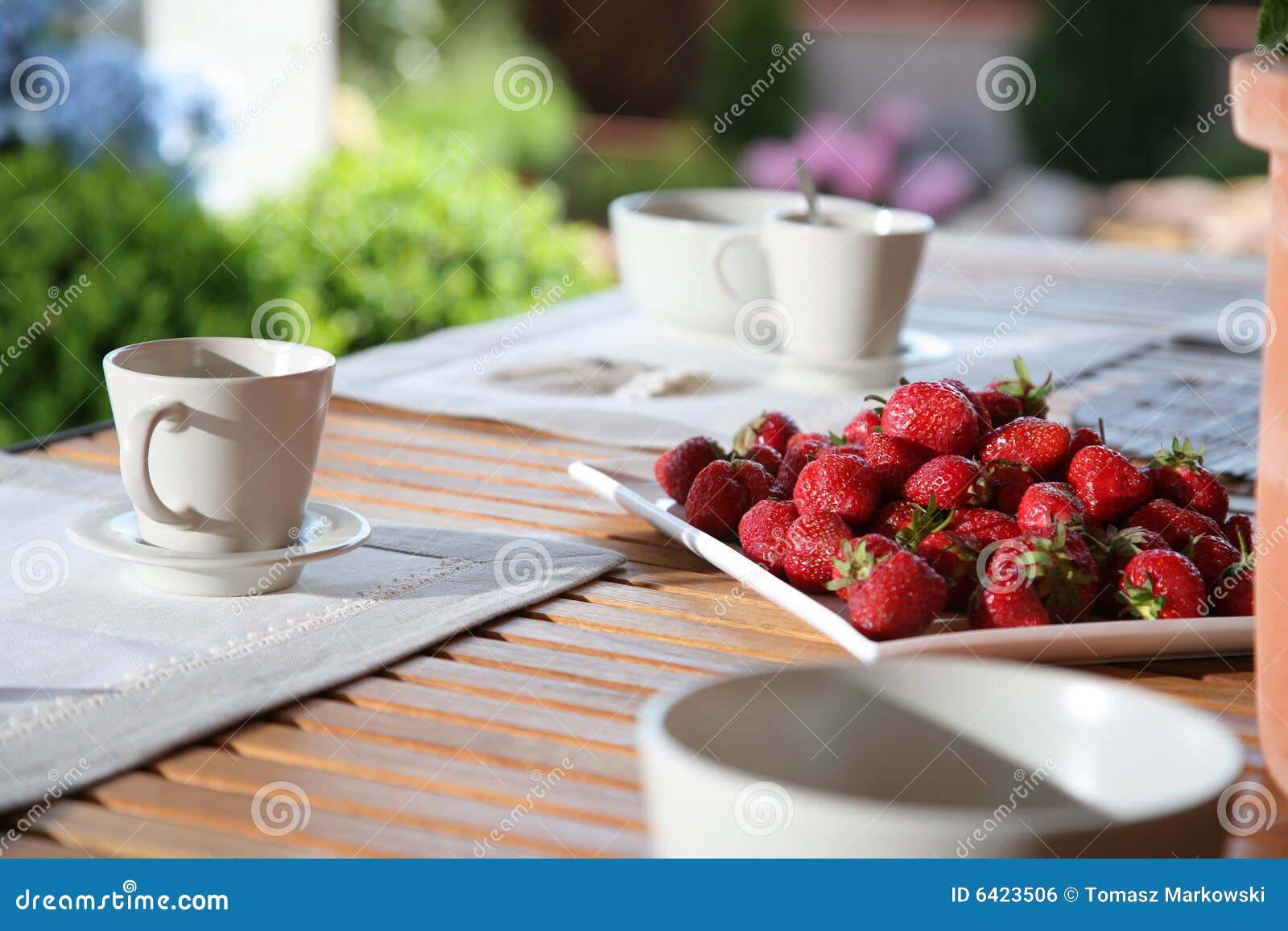 Strawberries on wood table stock photo. Image of porcelain - 6423506