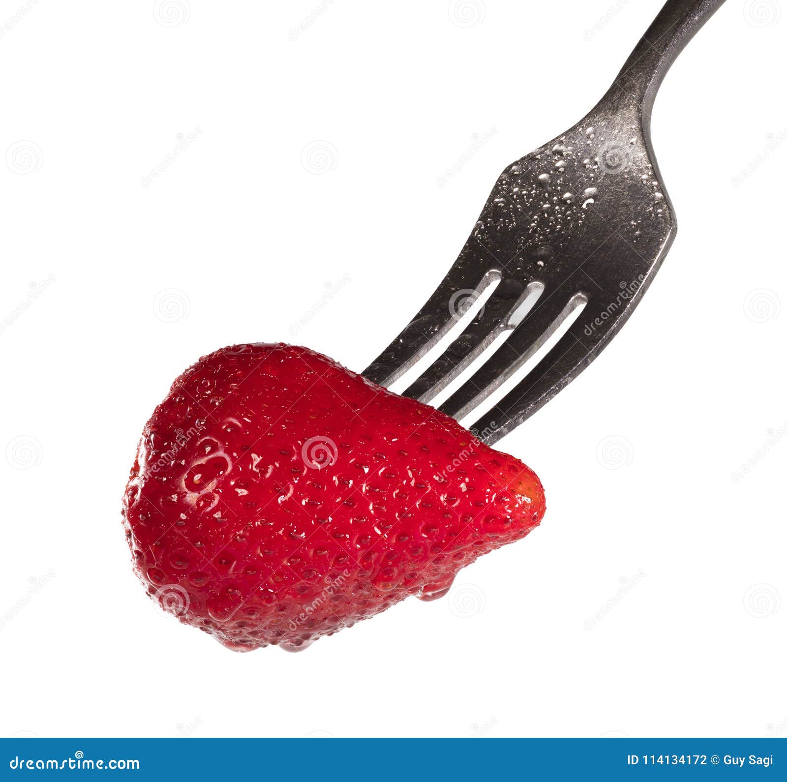 Fresh strawberry on a fork stock photo. Image of white - 114134172