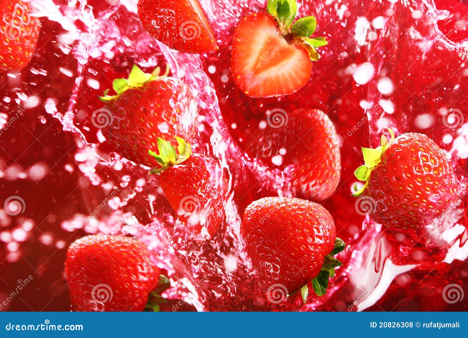 Strawberry Falling into the Lot of Juice Stock Photo - Image of ...