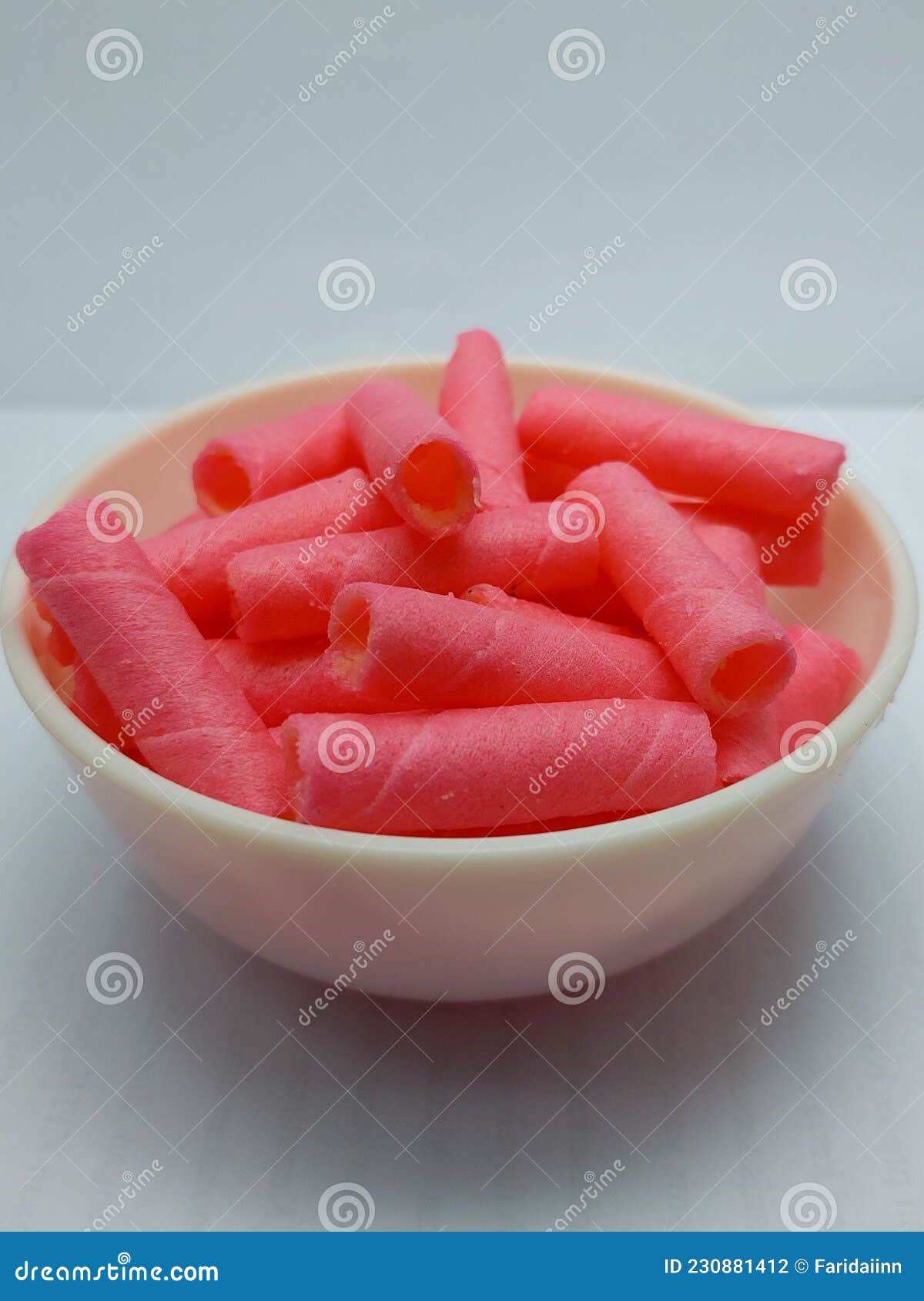 Strawberry Flavored Mini Wafer Rolls in a Bowl Stock Photo - Image of ...