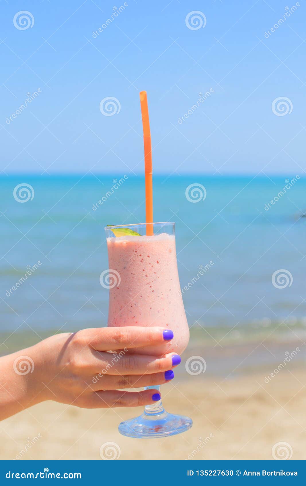 Strawberry Milkshake on the Beach Decorated with Lime Stock Photo ...