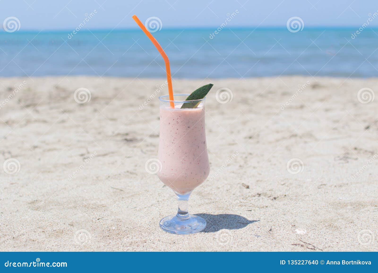 Strawberry Milkshake on the Beach Decorated with Lime Stock Photo ...