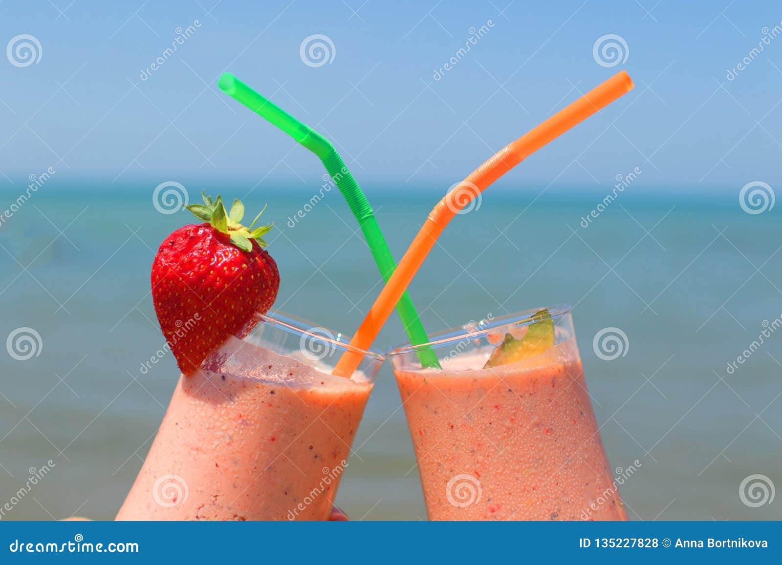 Strawberry Milkshake on the Beach Decorated with Lime Stock Photo ...