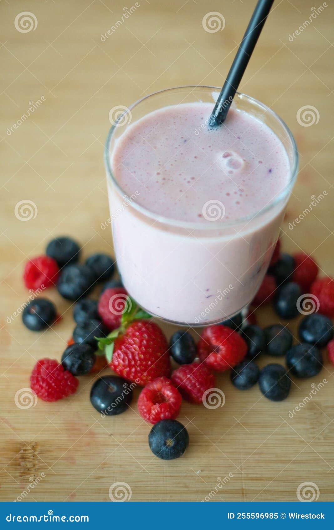 A Strawberry, Raspberry, and Blueberry Smoothie in the Glass with ...