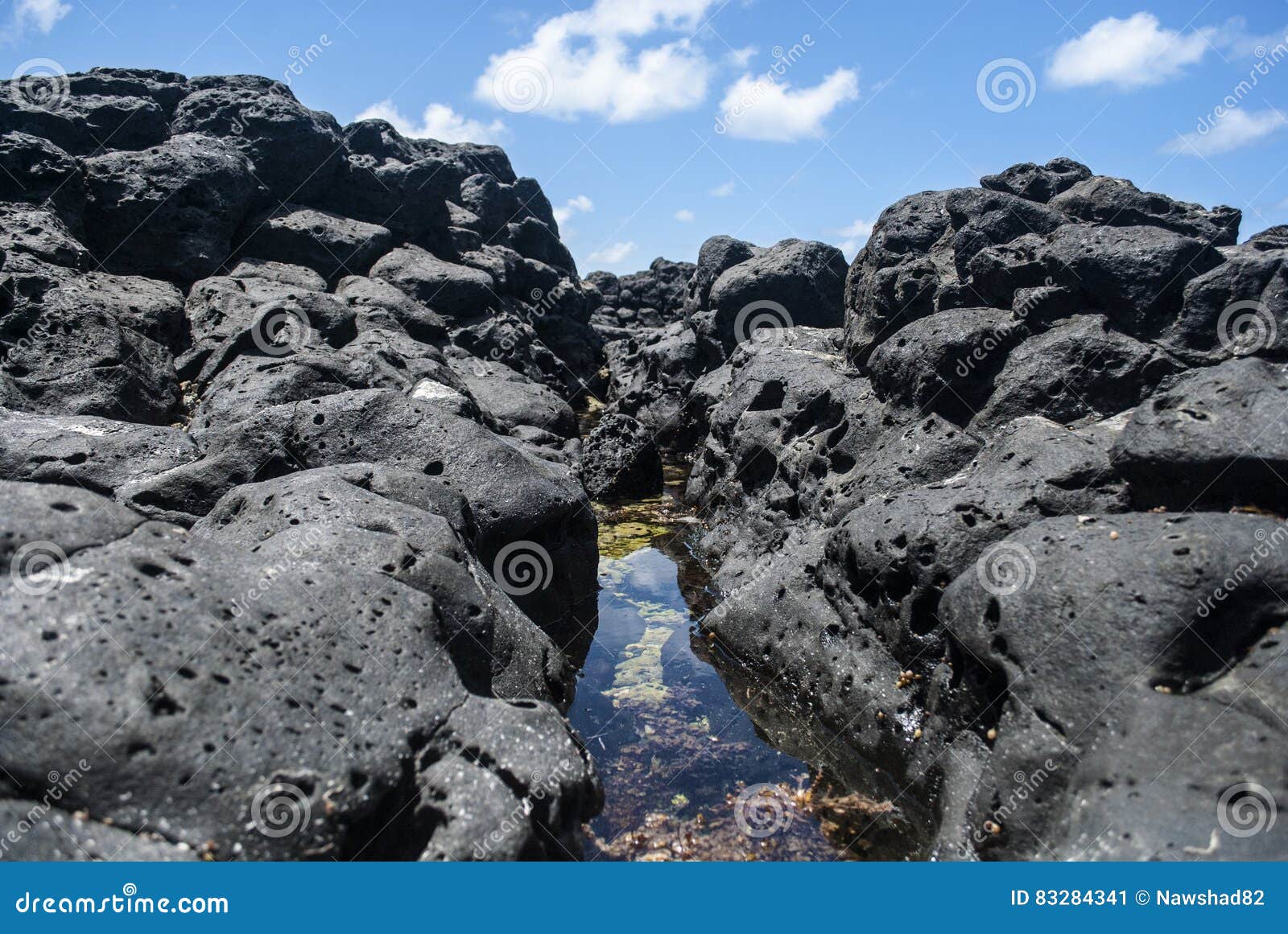 Stream in blue basalt stock image. Image of river, clouds - 83284341