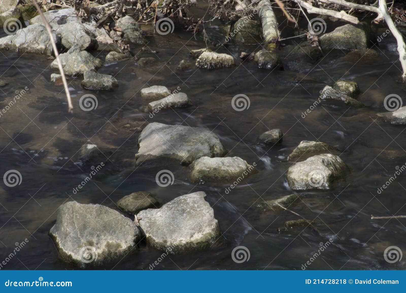 Stream Flowing through Group of Rocks Stock Photo - Image of shallow ...