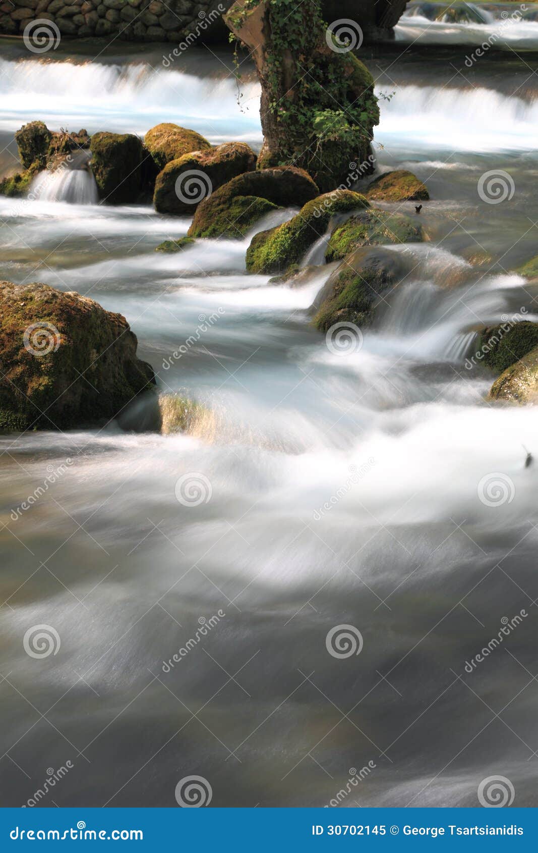 Stream flowing over rocks stock image. Image of travel - 30702145