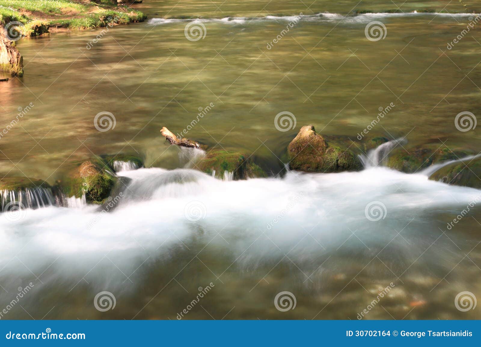 Stream flowing over rocks stock photo. Image of spring - 30702164