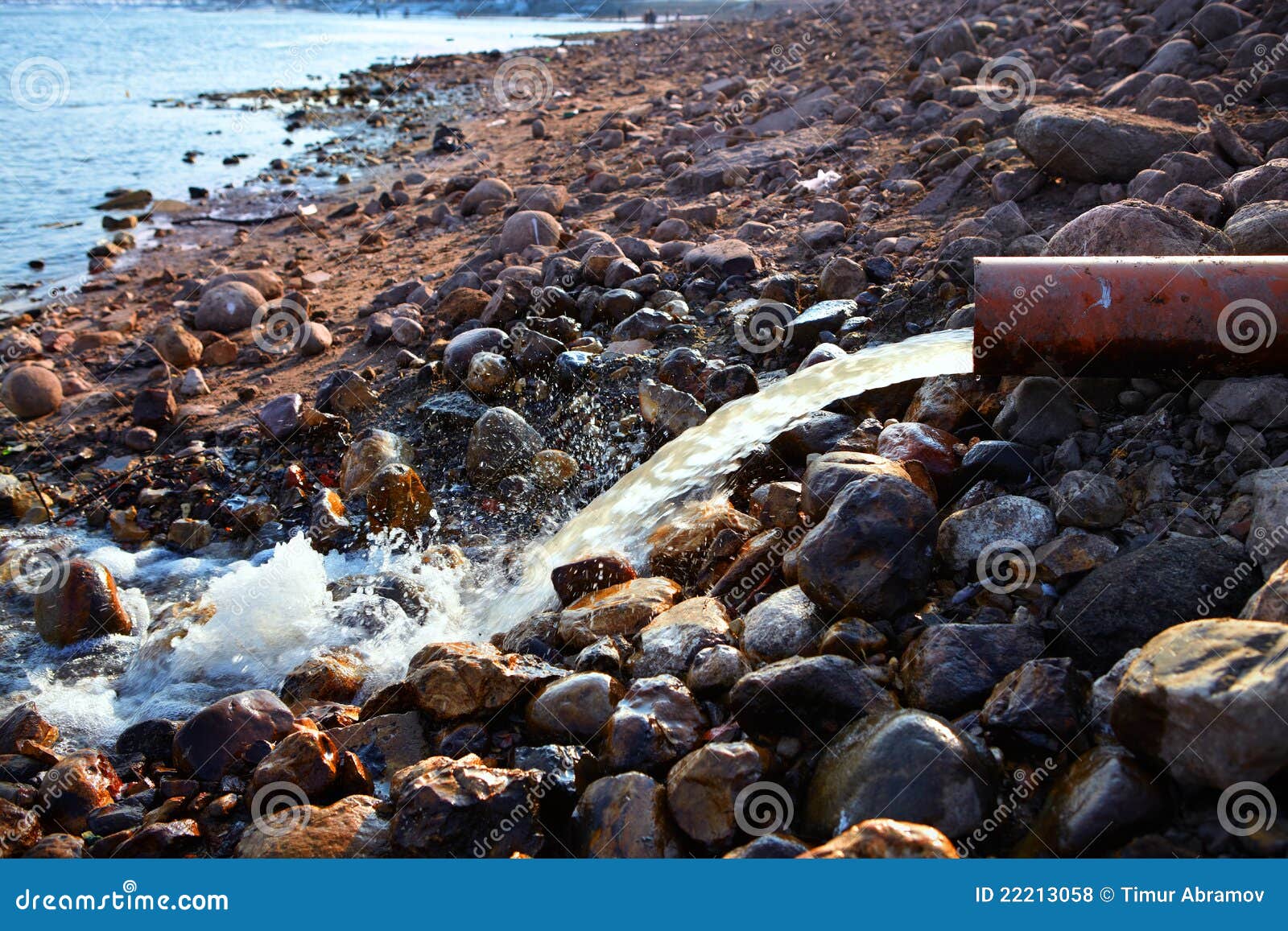 Stream Flowing from a Pipe on Rocks in Spring Stock Photo - Image of ...
