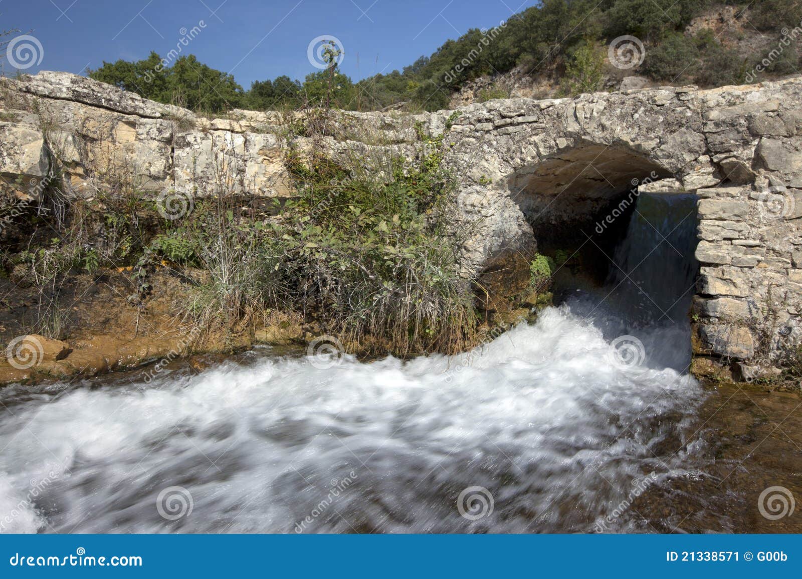Stream Flowing Under a Small Stone Bridge Stock Image - Image of ...