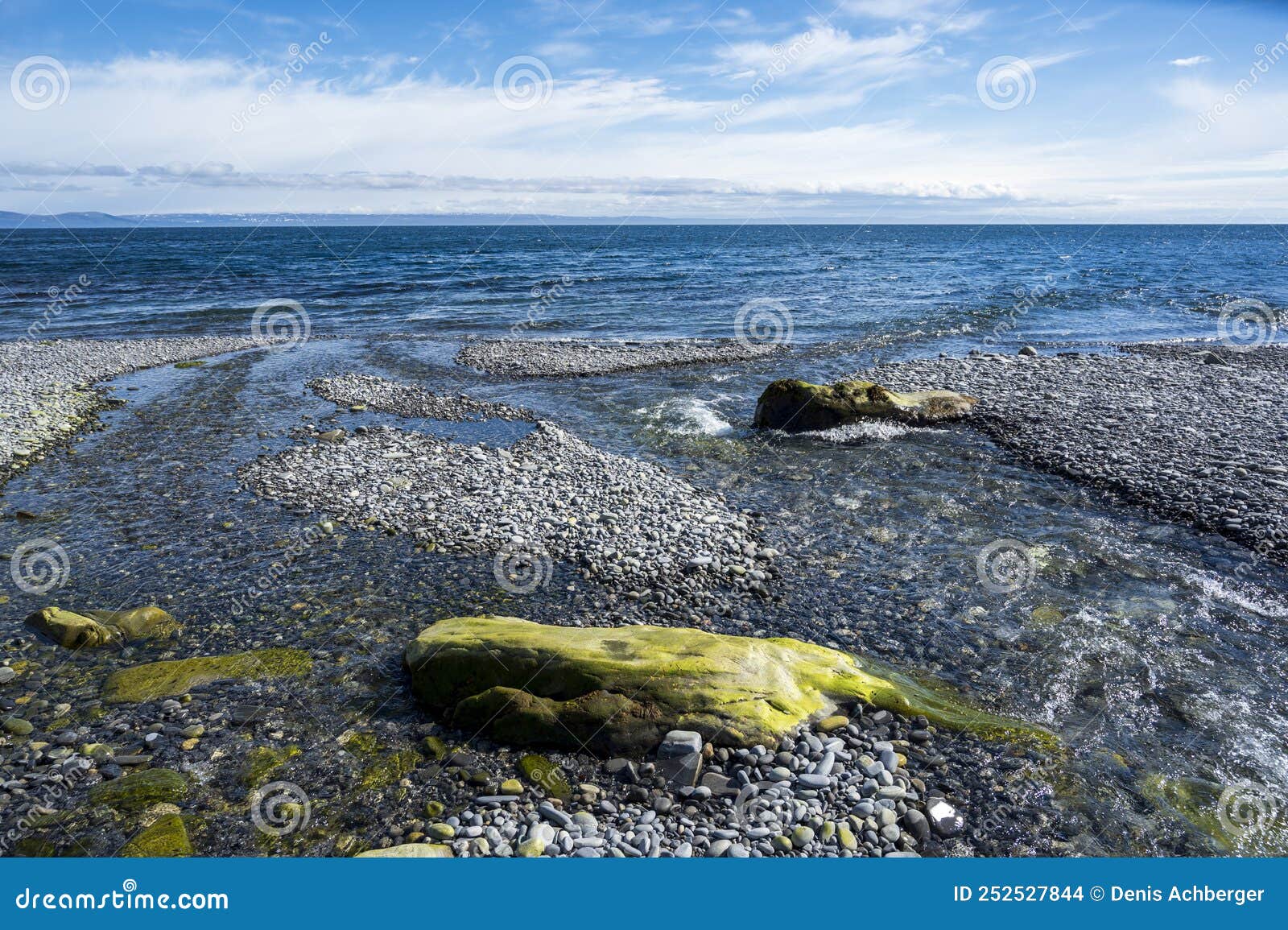 Stream flows into the sea stock photo. Image of scenery - 252527844