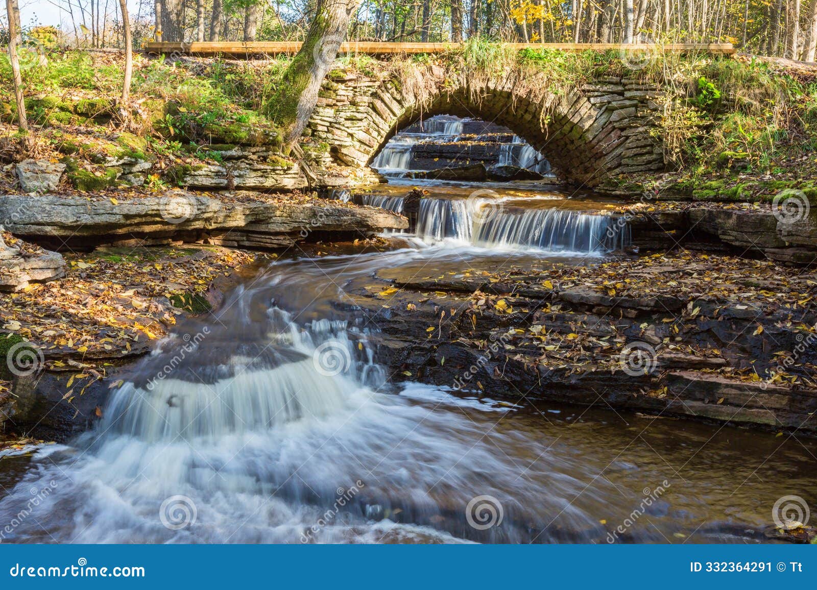 Stream Running into a Ravine, with an Old Arch Bridge Stock Image ...