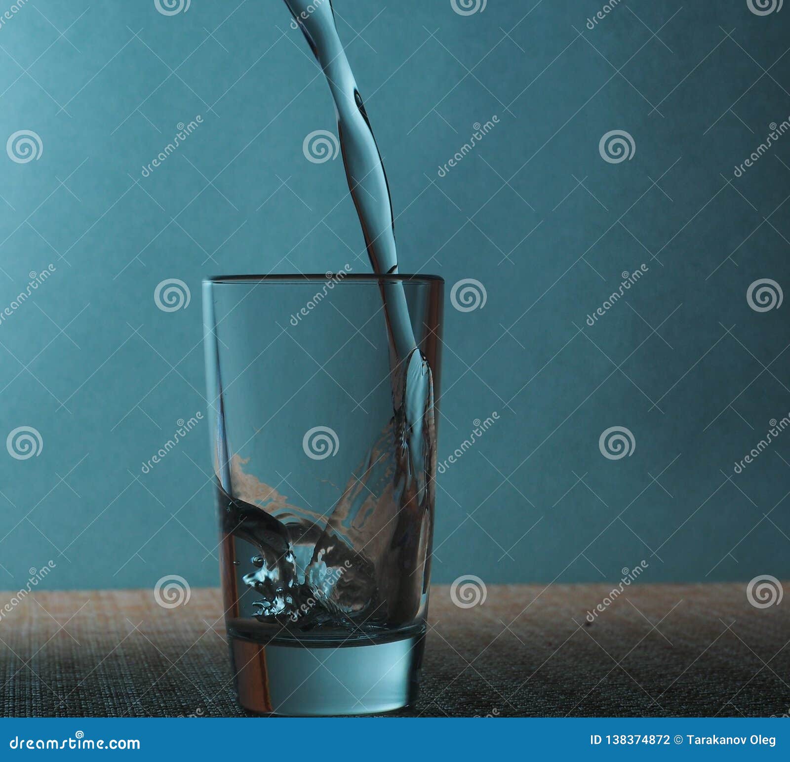 The Stream of Vodka is Poured into a Glass Stock Photo - Image of drip ...