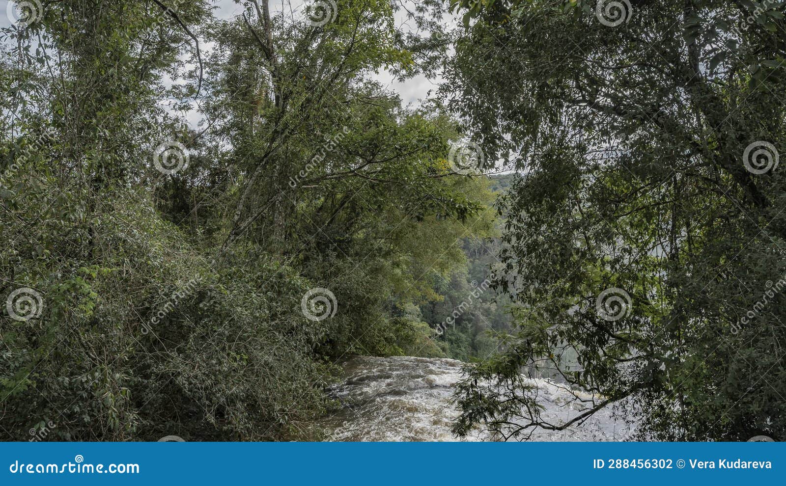 A Stream of Water Falls from the Edge of the Ledge into the Abyss ...