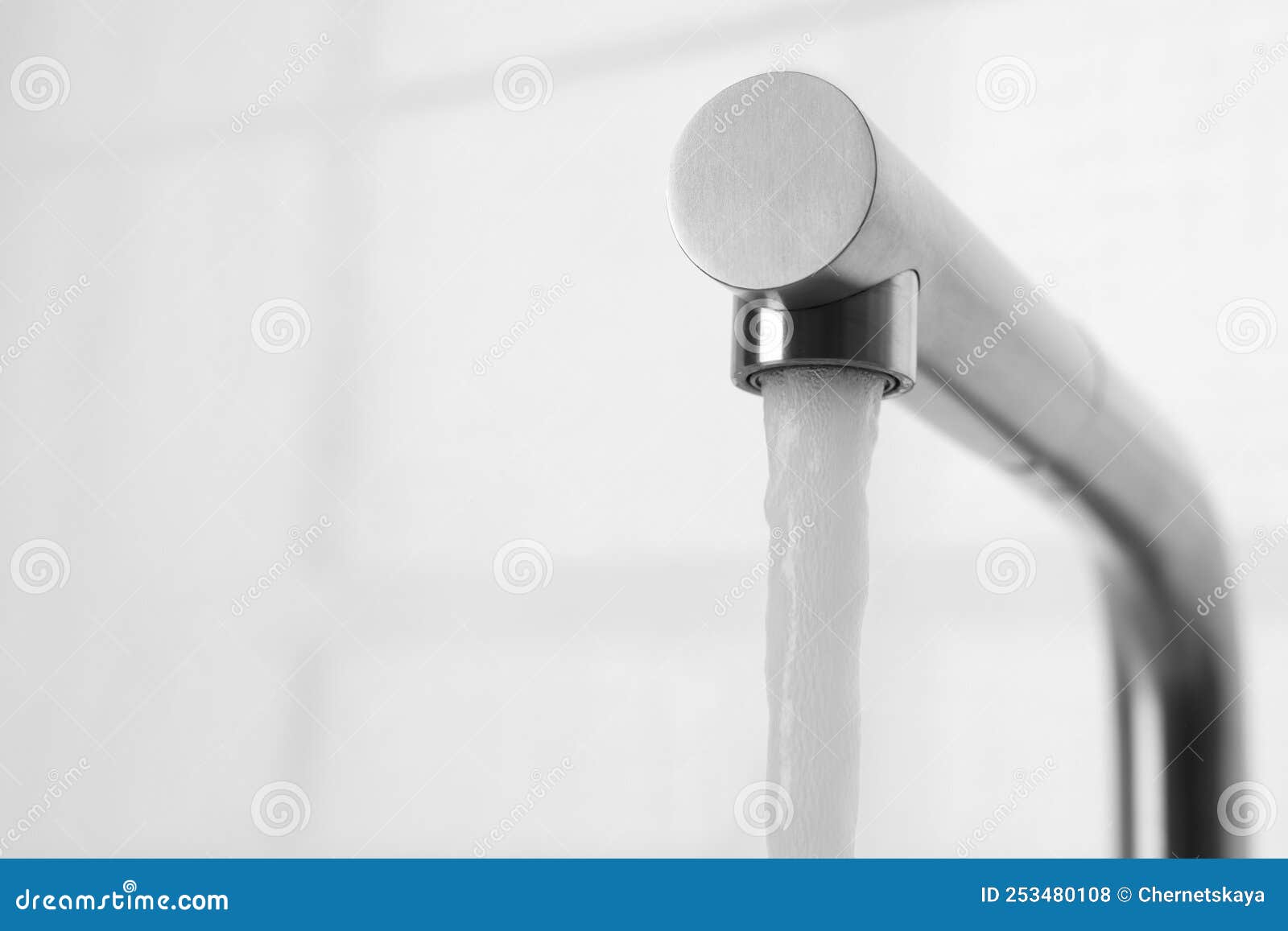 Stream Of Water Flowing From Tap On White Background Closeup Space