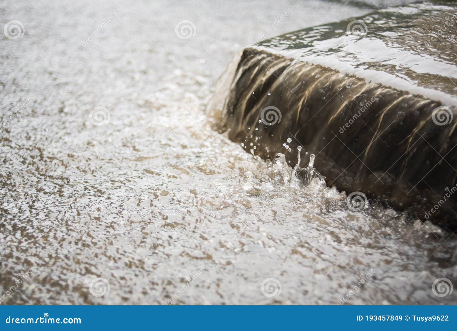 The Stream of Water Flows Down from the Sidewalk. Stock Image - Image ...