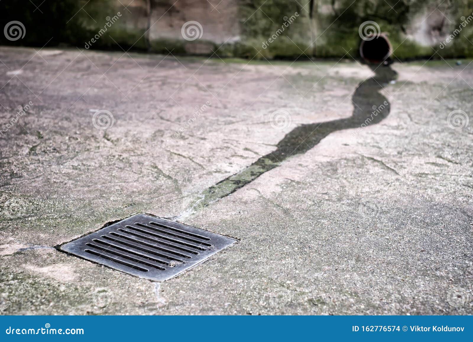 Stream of Water Flows into the Drain Hatch after Rain Stock Photo ...