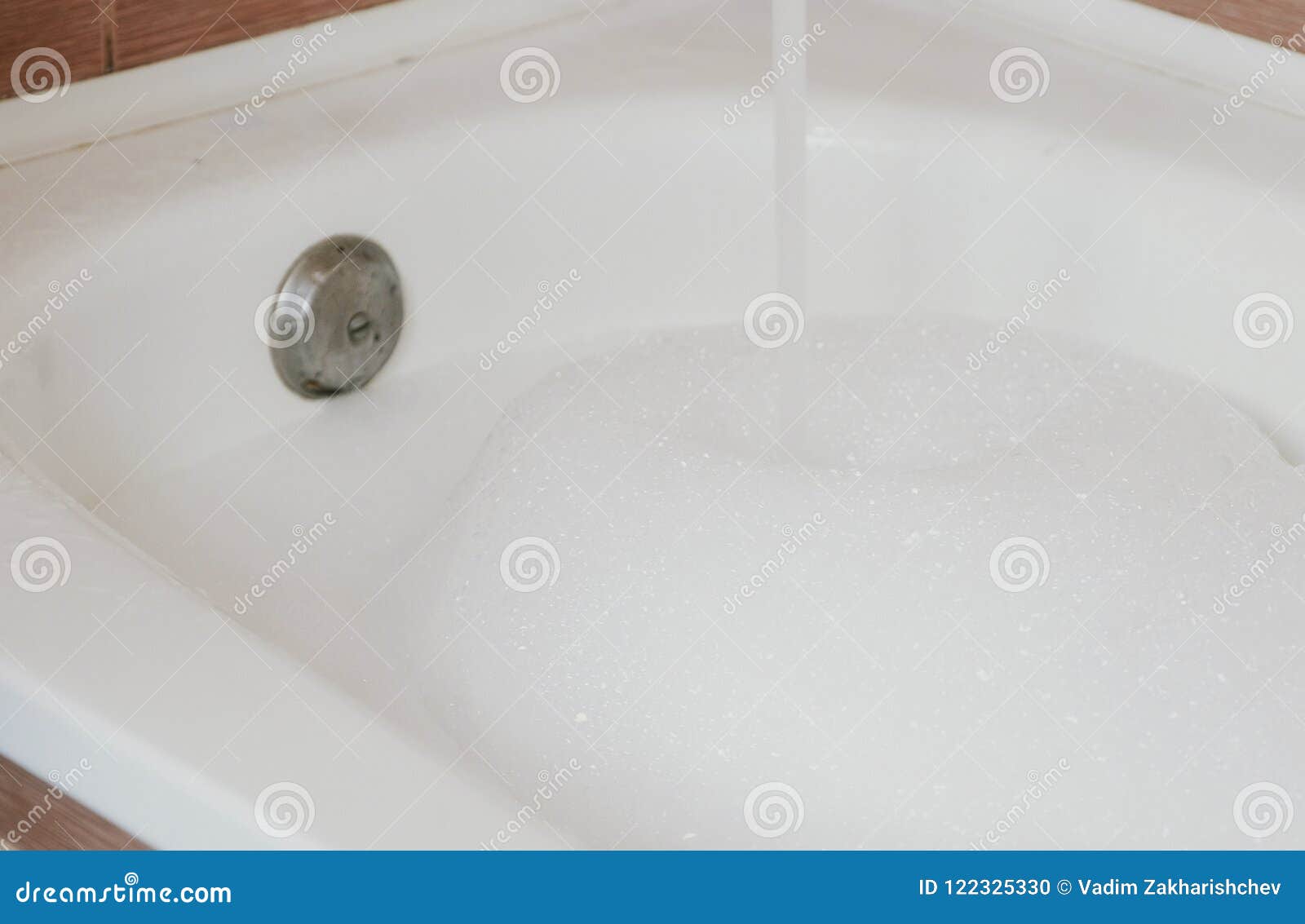 Stream of Water Pouring into the Bath with Foam. Stock Photo - Image of ...