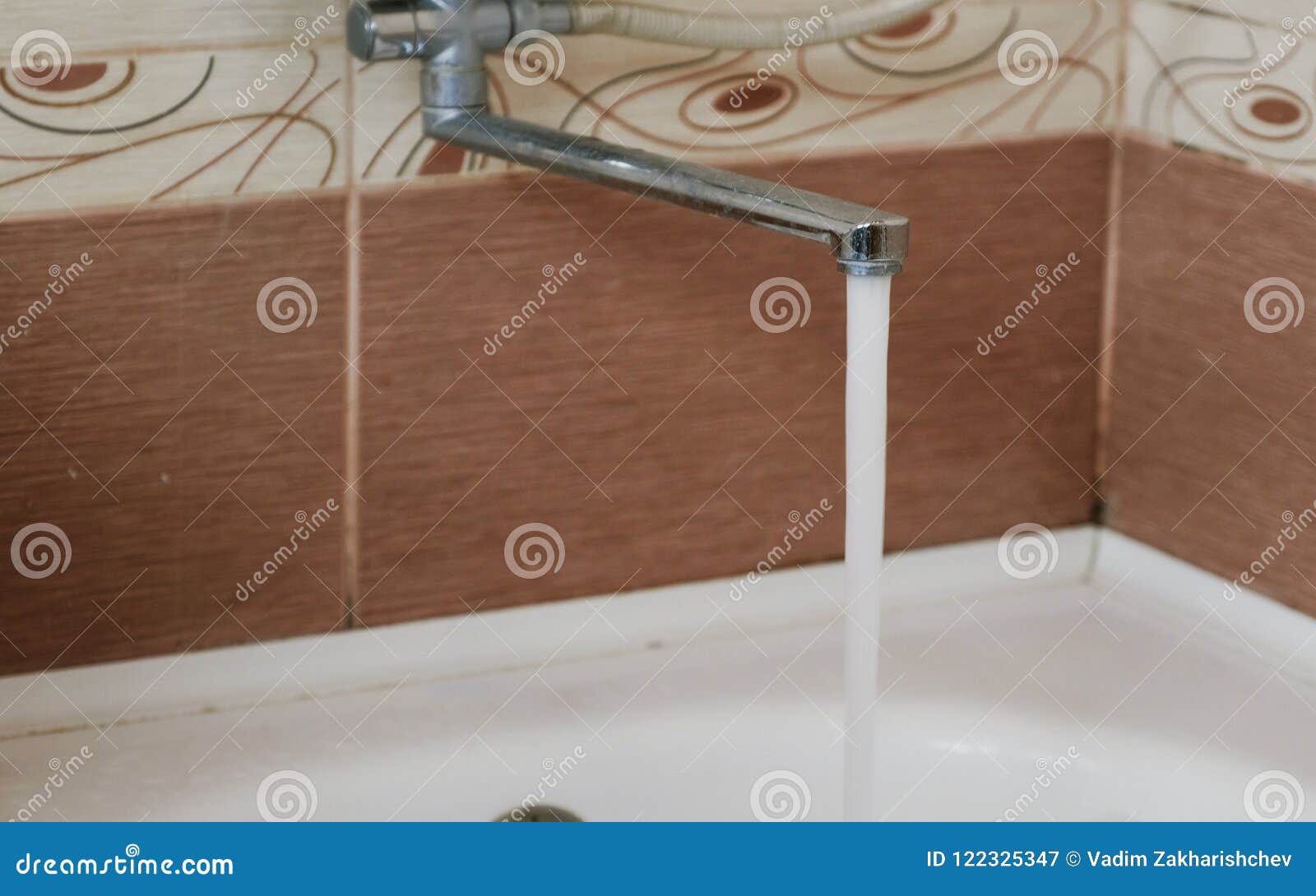 Stream of Water Pouring into the Bath with Foam. Close Up. Stock Image ...