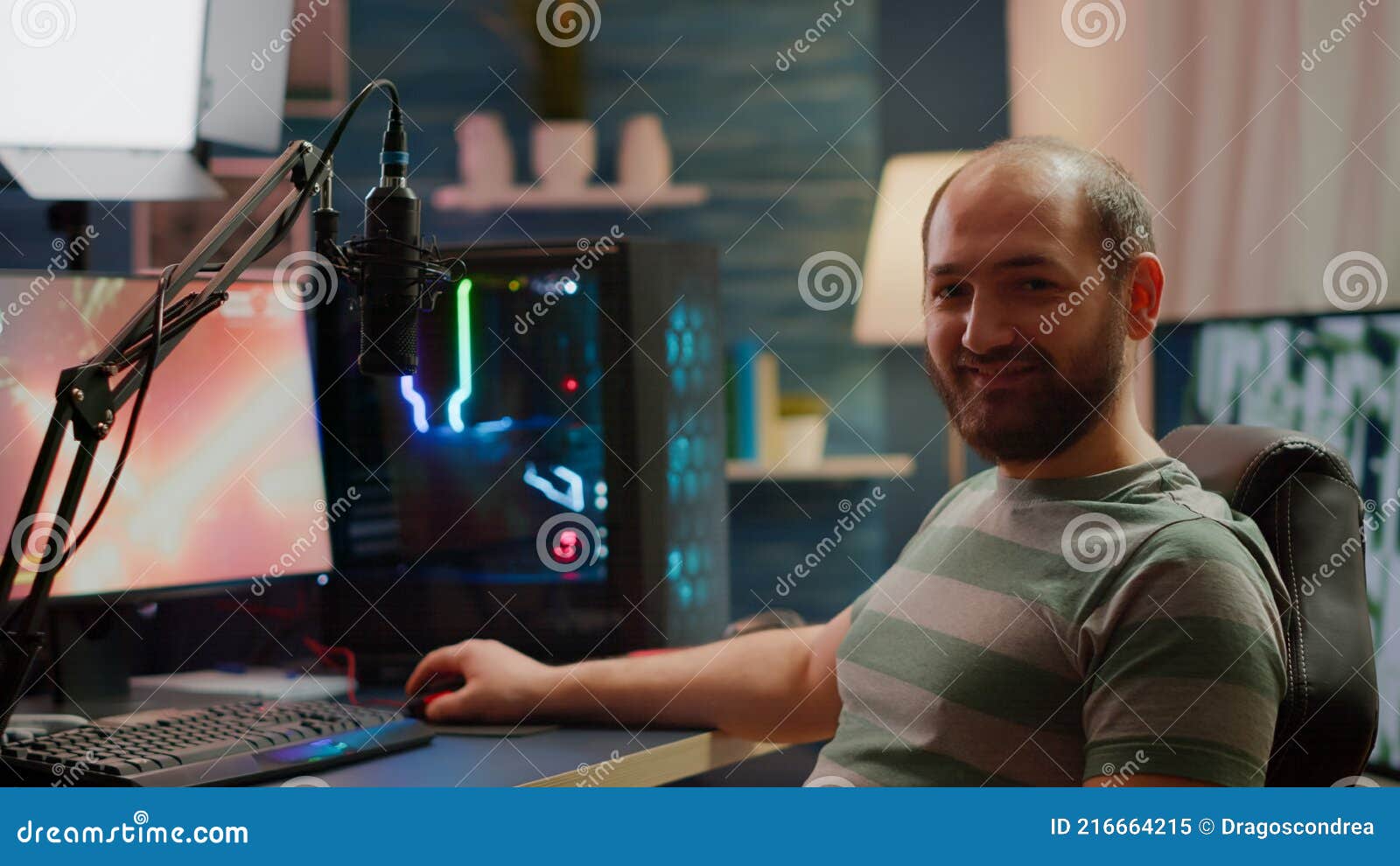 Streamer Man Looking at Camera Smiling while Streaming Videogames Stock ...