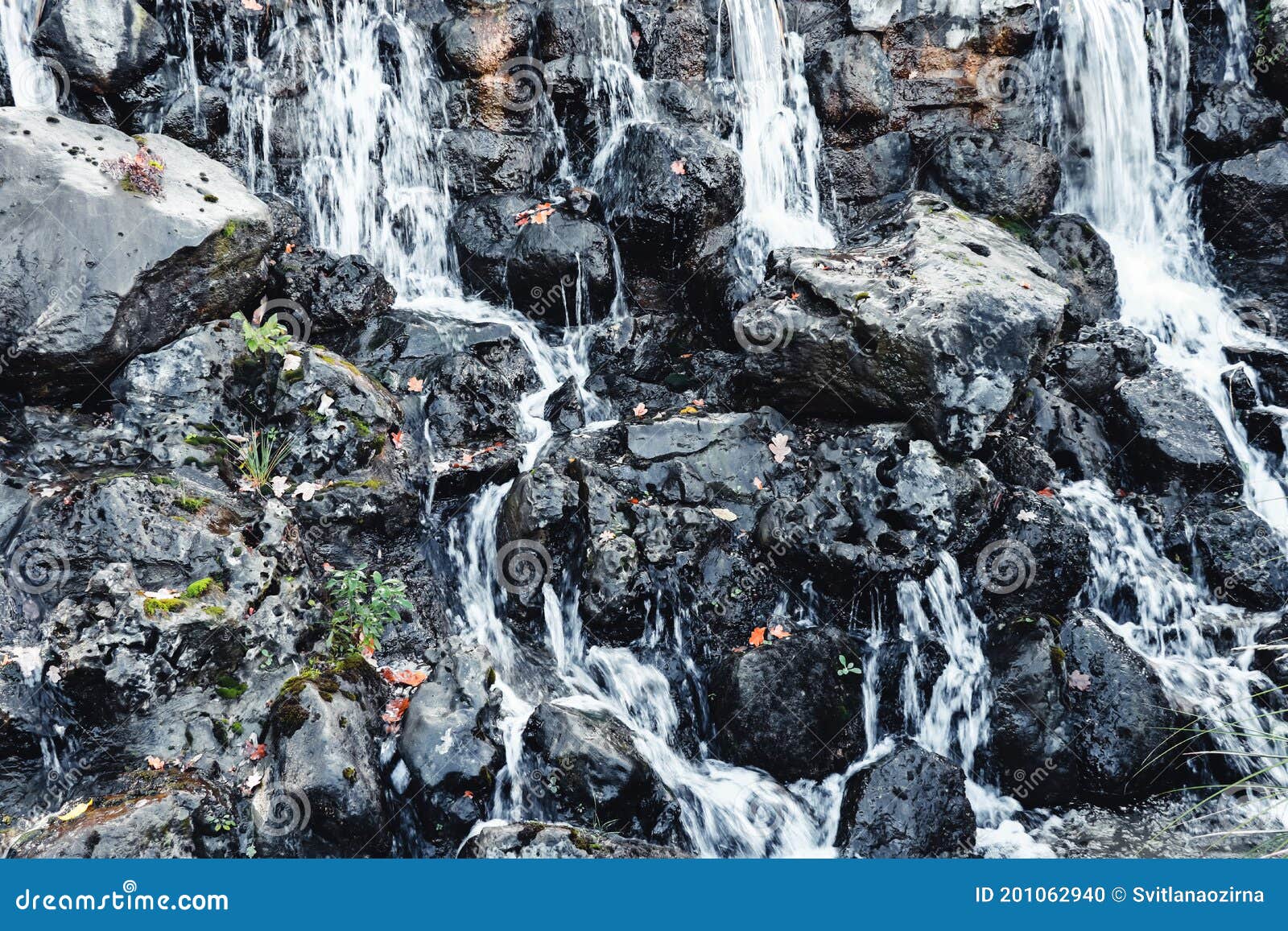 Streams of Water Flow Down a Steep Stone Wall Stock Photo - Image of ...