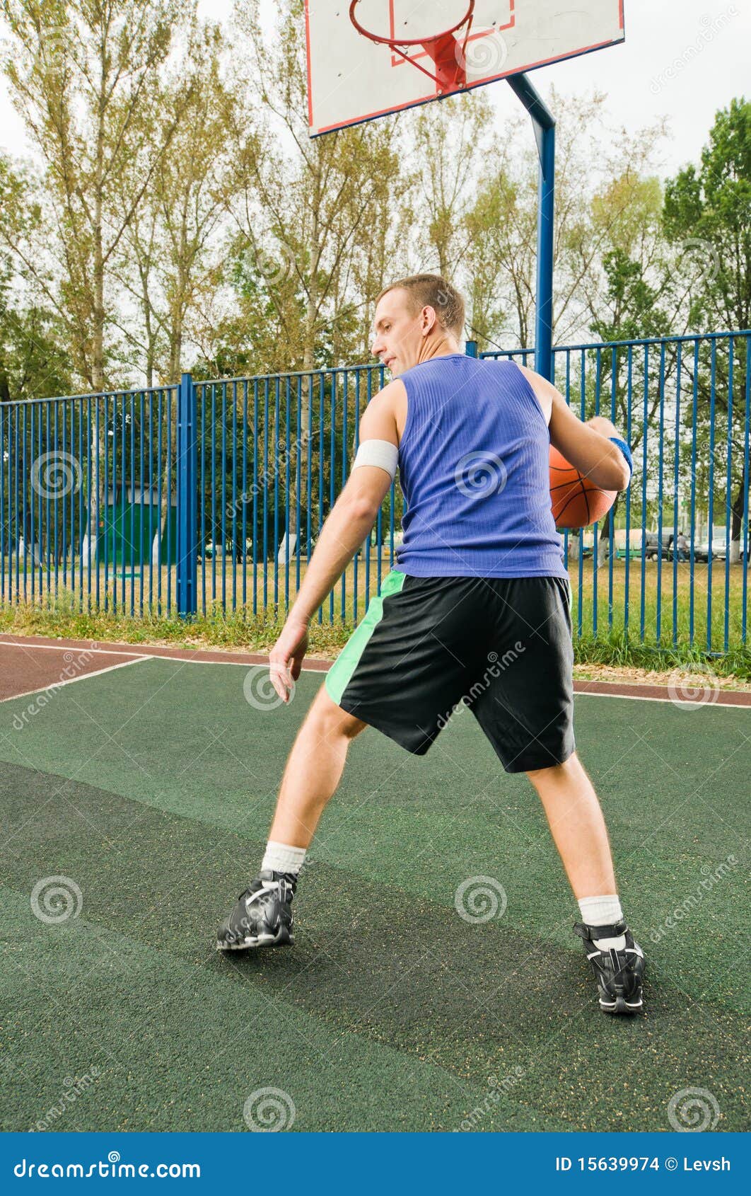 Street Basketball Athlete Performing Slam Dunk On The Court Royalty ...