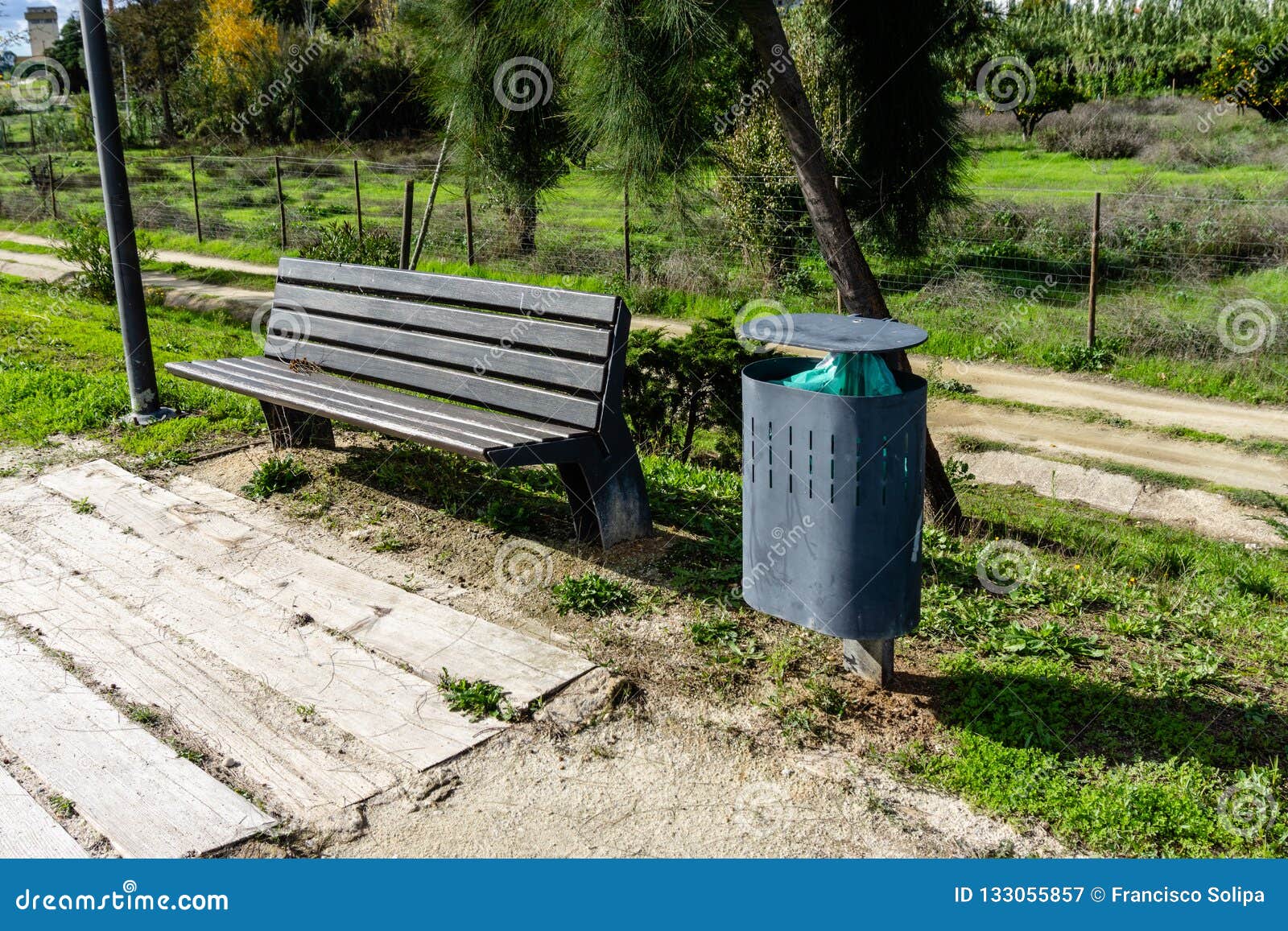 Street Bench Next To the Modern Garbage Bin Stock Image - Image of ...