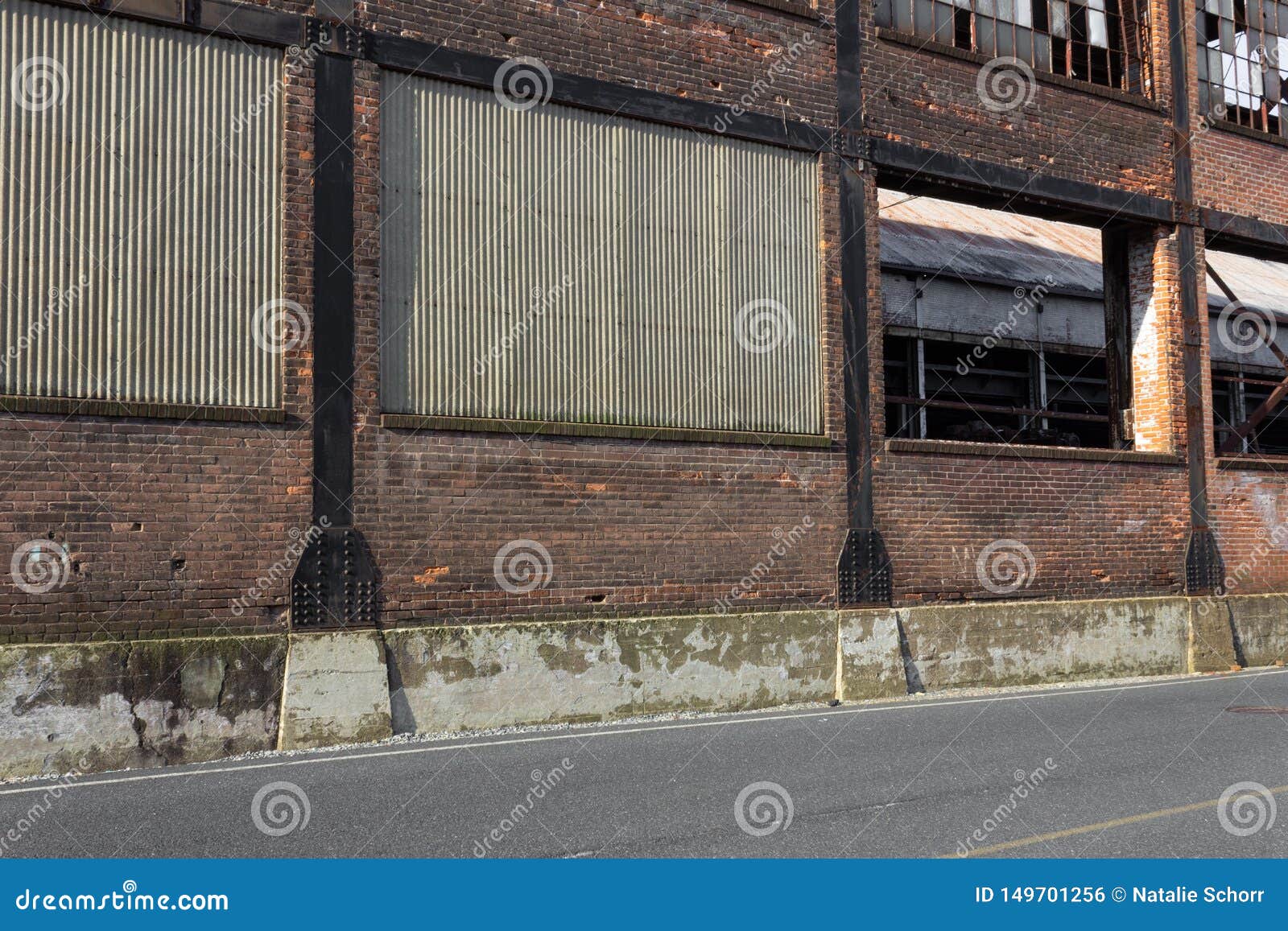 Street Bordered by a Brick Wall, Corrugated Metal and Open Structure ...